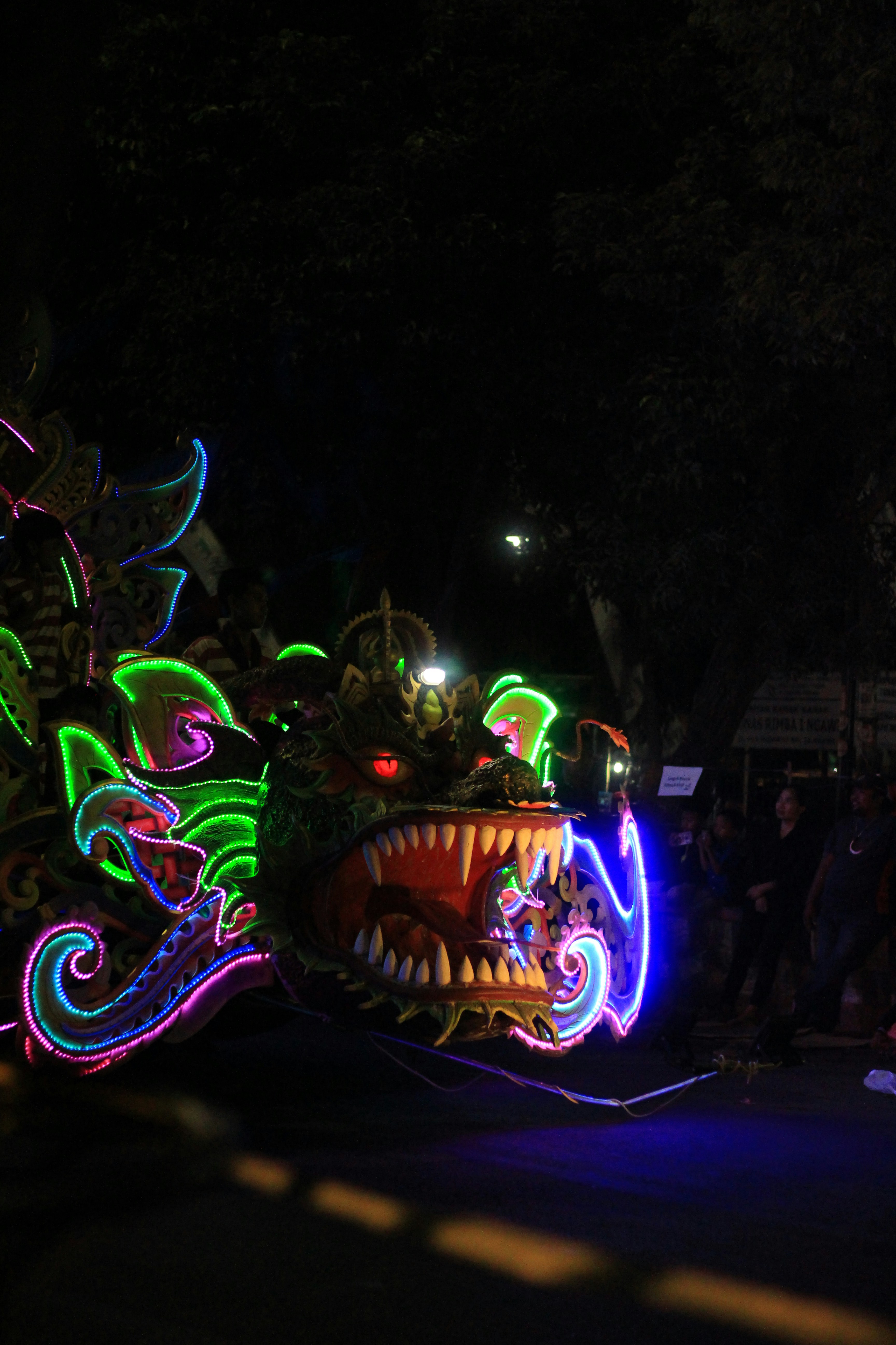 Glow-Headed Dragon Floats Across a Midnight Parade
