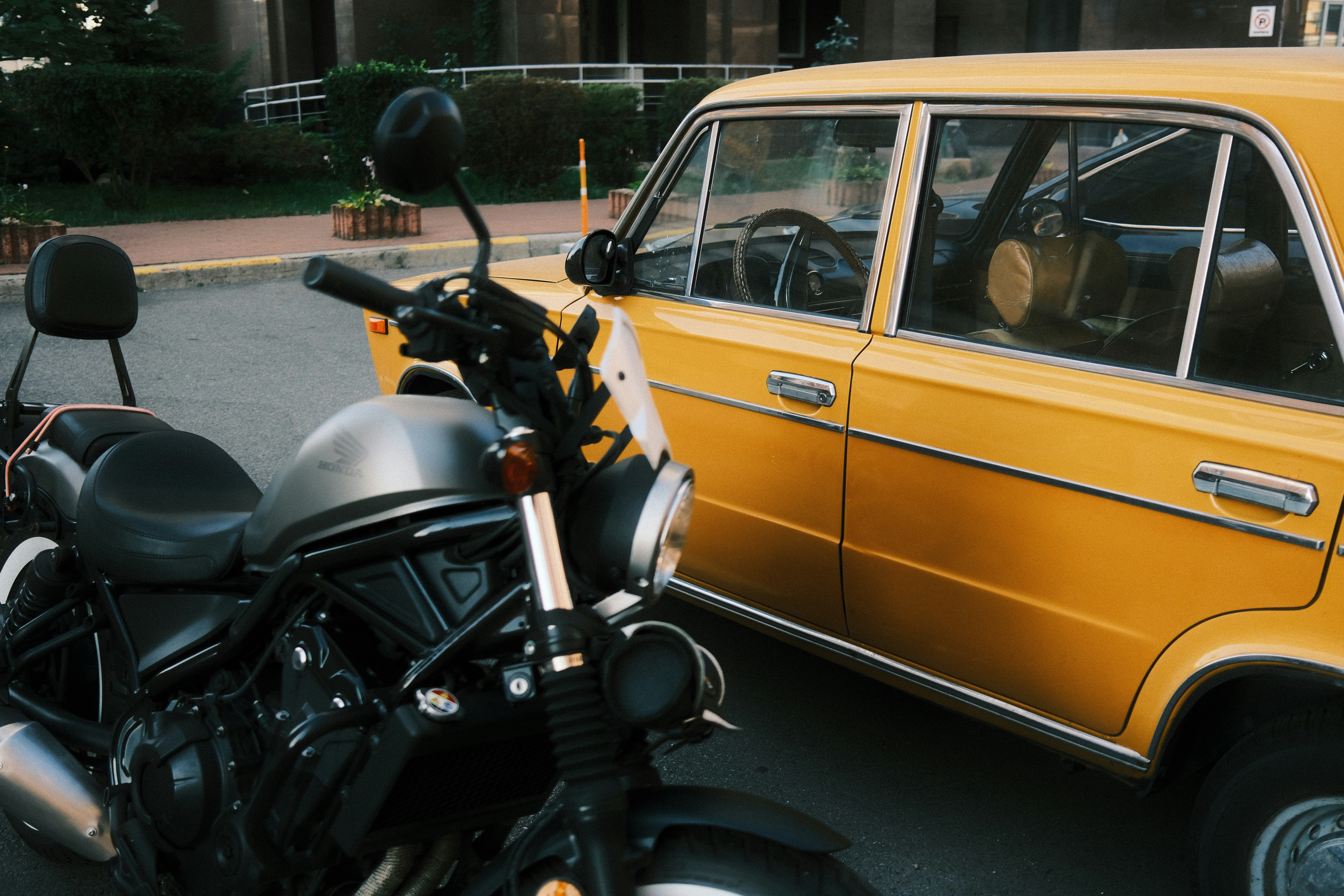 Yellow Classic in the Shadow of Chrome: A Street-Front Moment