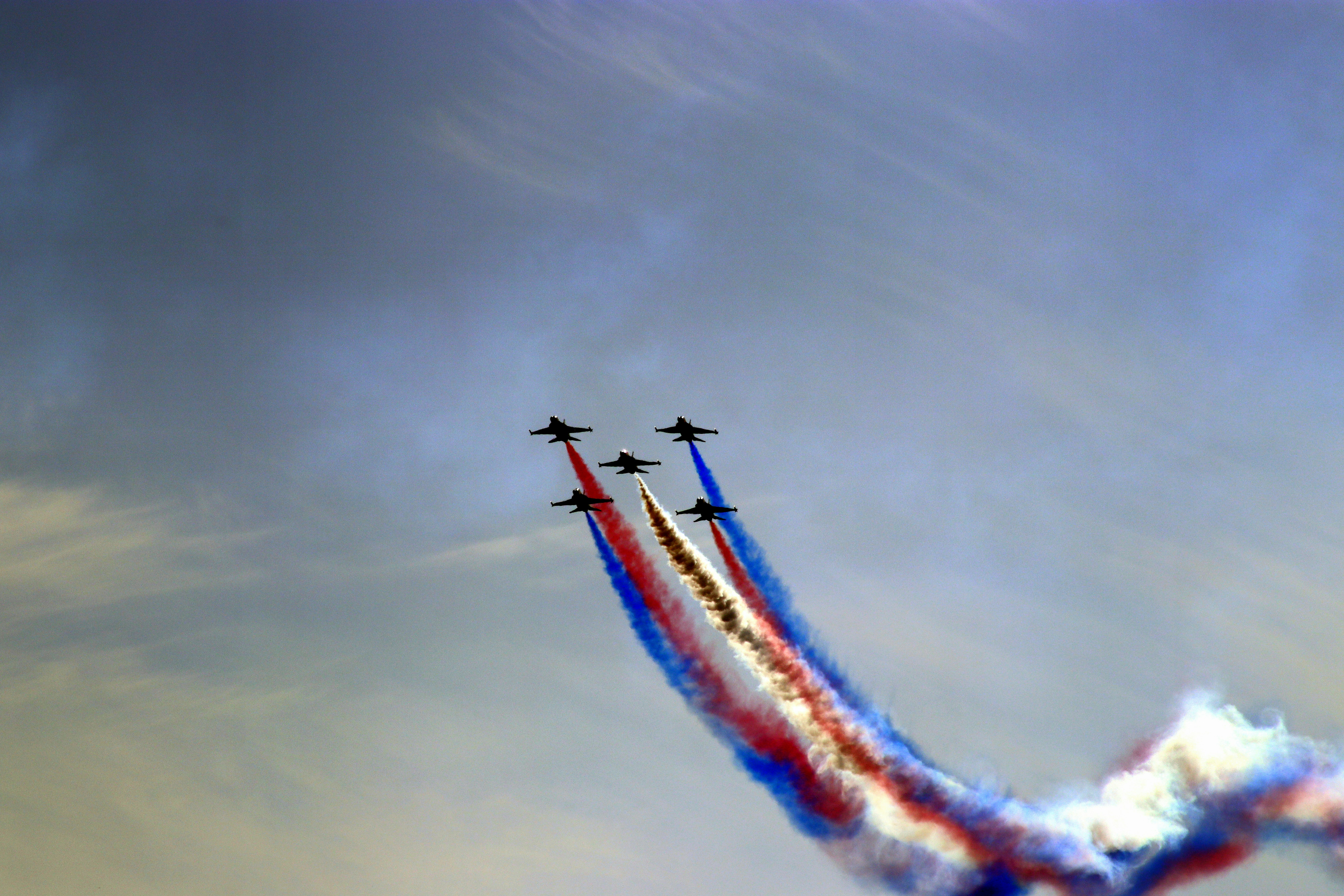 Tri-Color Smoke Run: Flight Team Trails in a Clear Sky