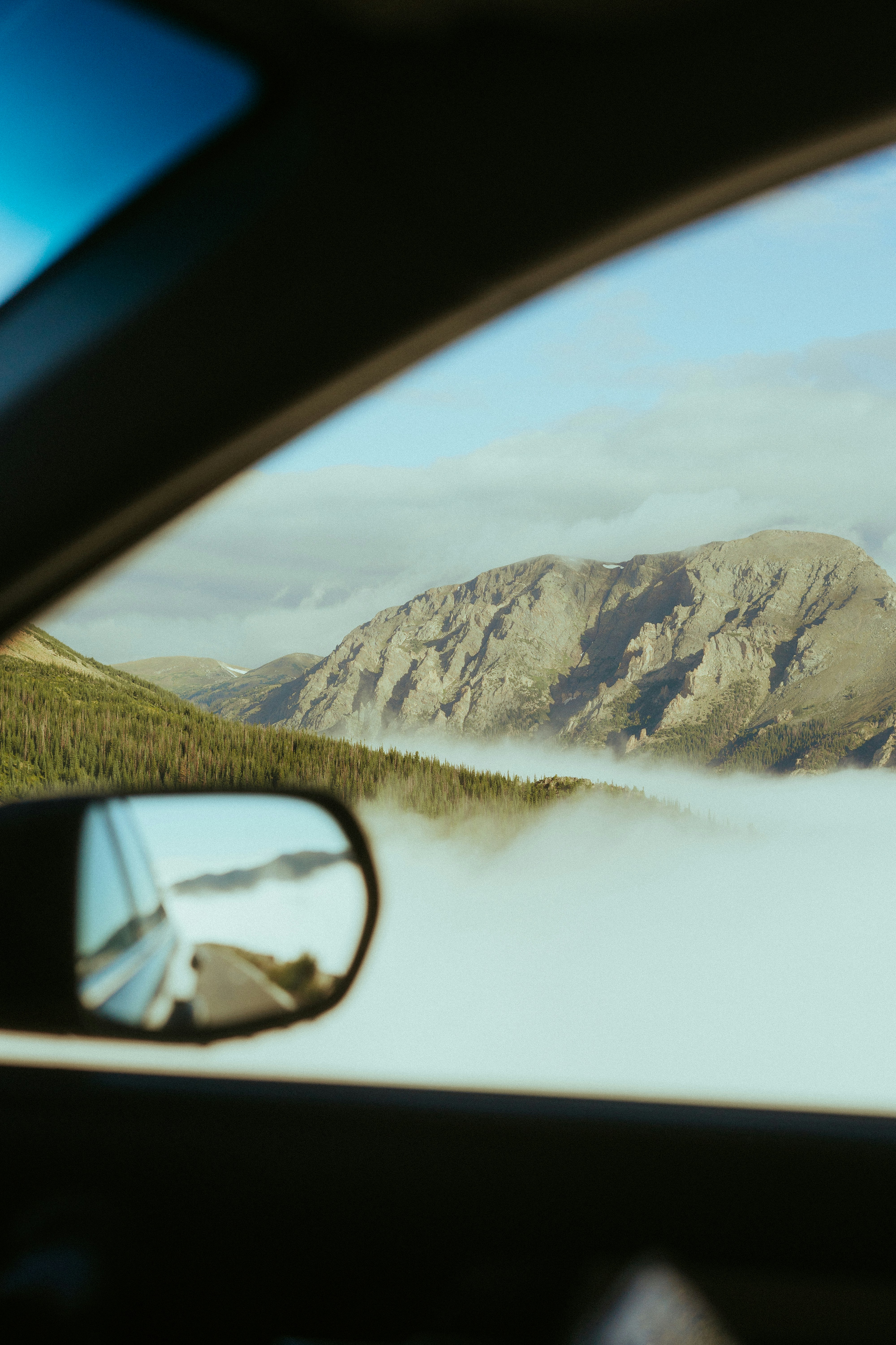 Mountain Dawn Drive: A Glimpse Through the Car Window