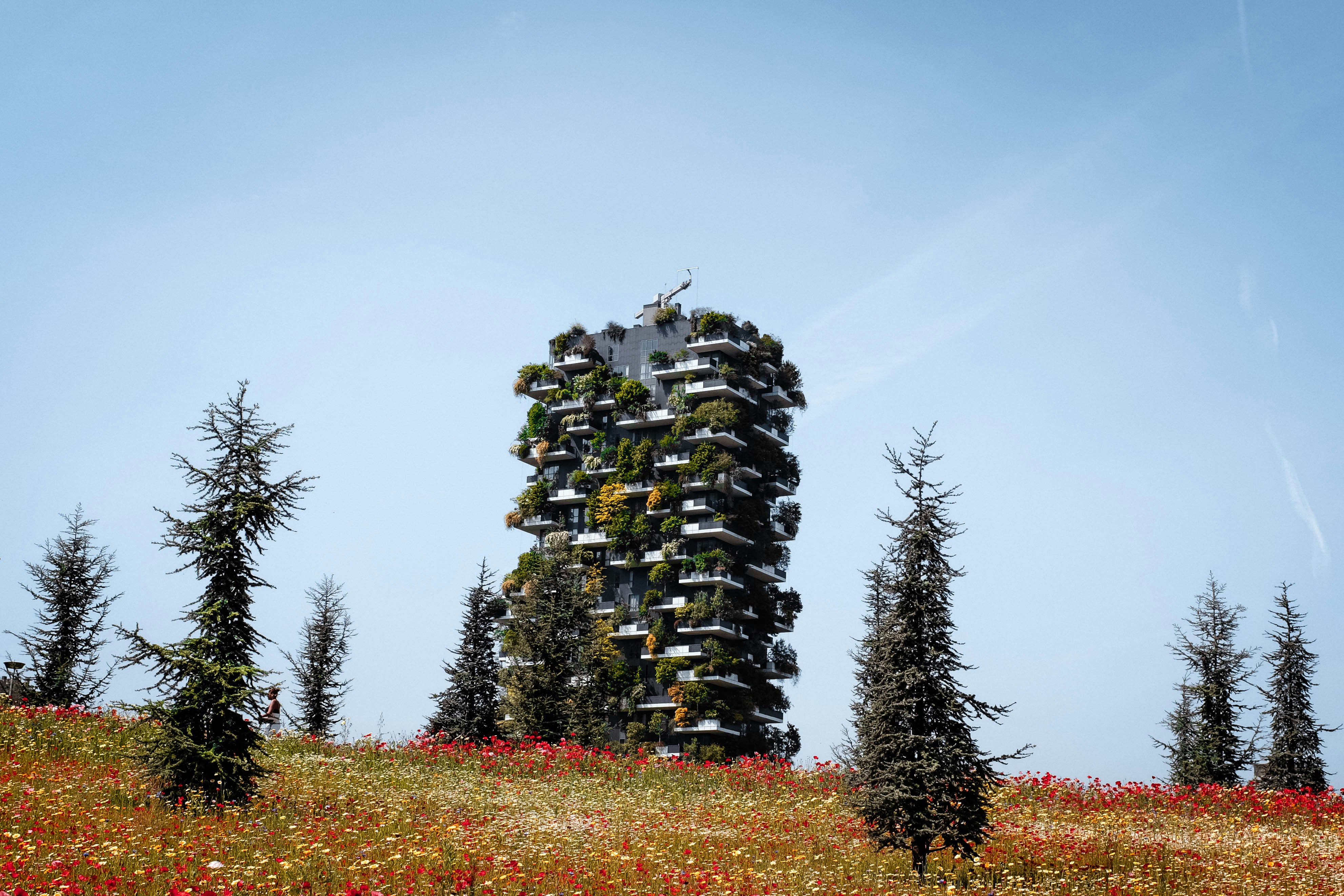 A tall tower with plants growing out of it photo – Free Milan Image on ...