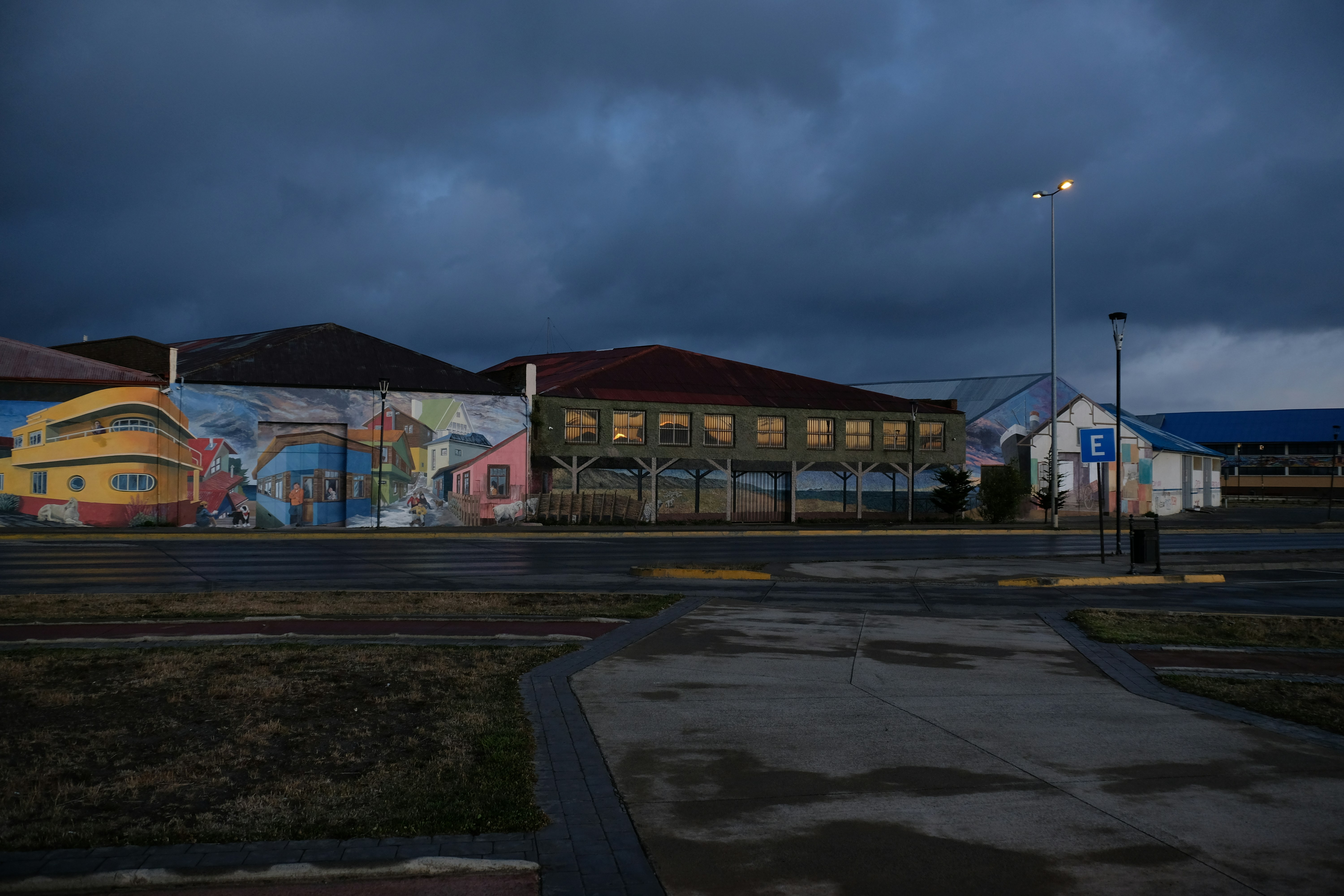 Dusk on the Mural Row: A Kaleidoscope of Waterfront Buildings