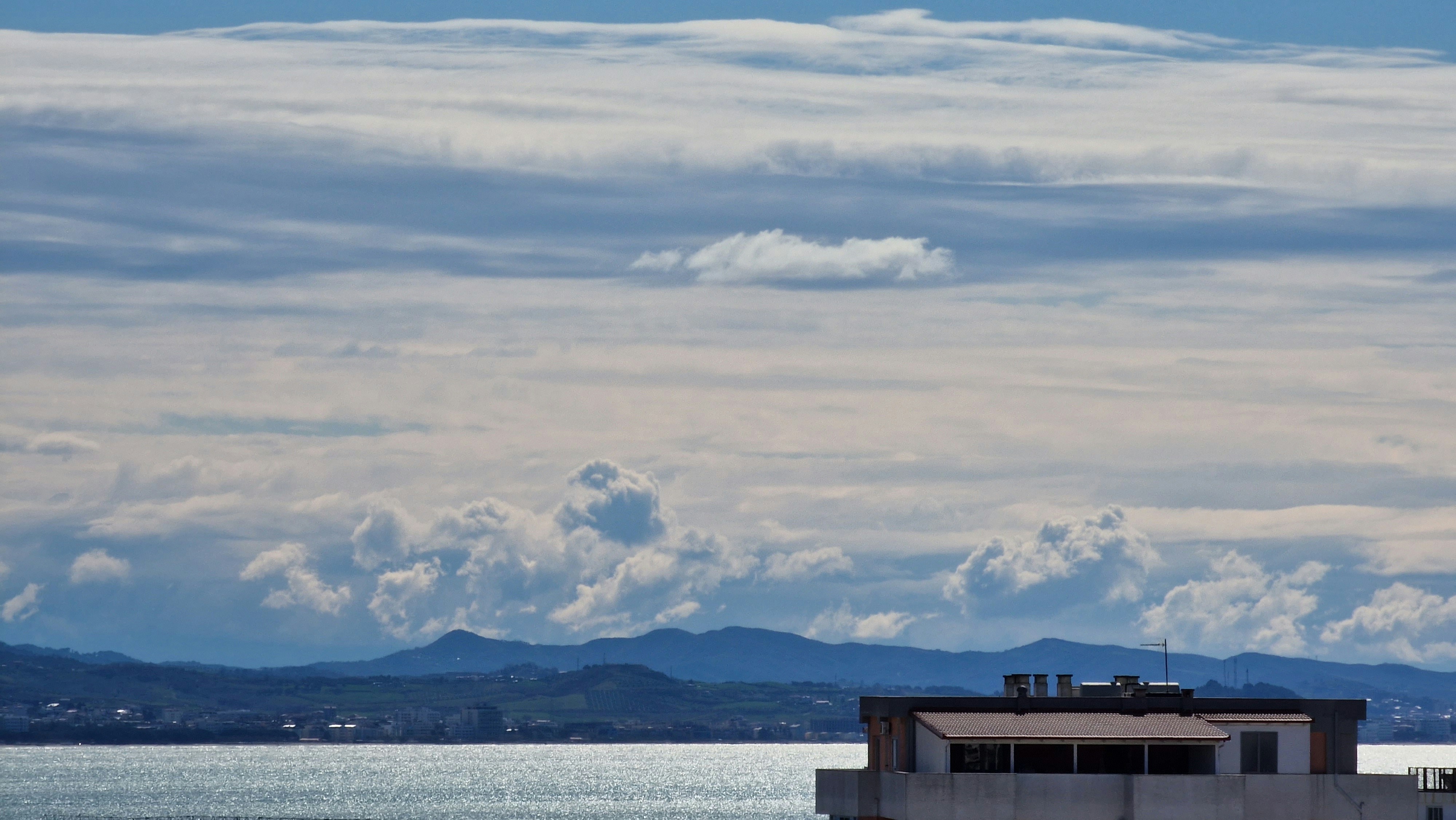 Horizon Lines: Distant Hills Under a Layered Sky
