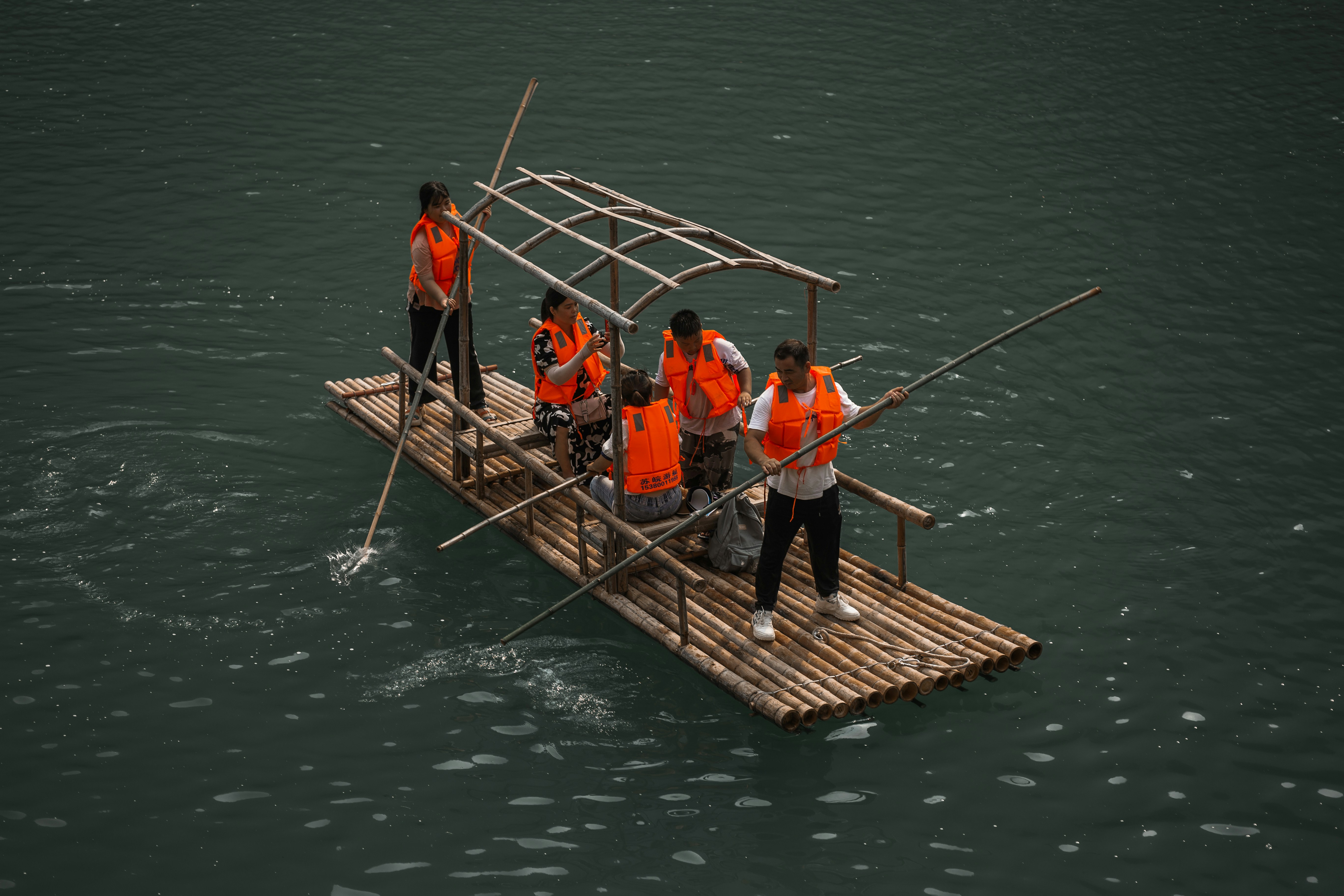 A group of people on a raft in the water photo – Free Man Image on Unsplash