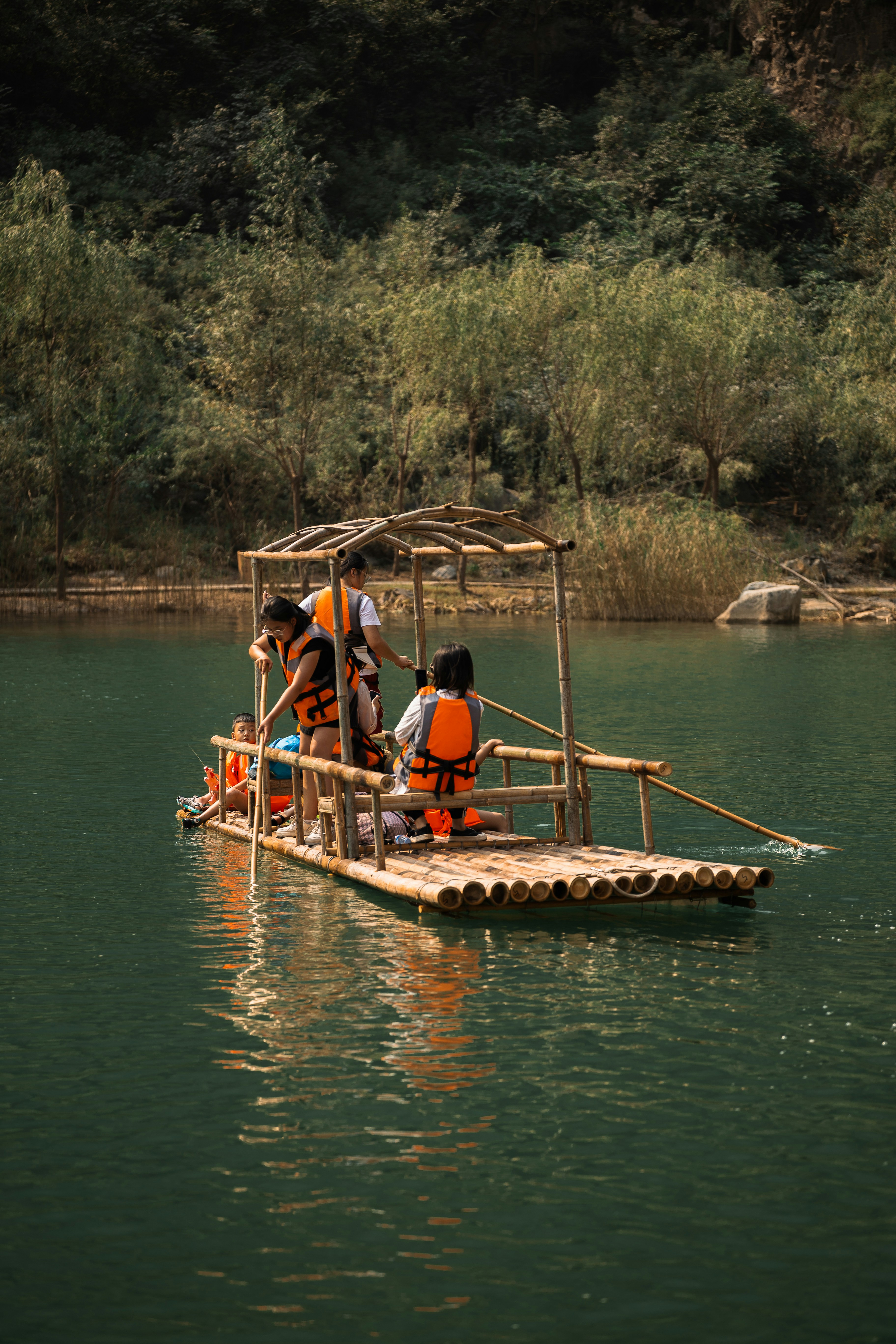 Bamboo Rafting on Teal Waters: A Family Adventure on a Quiet Lake