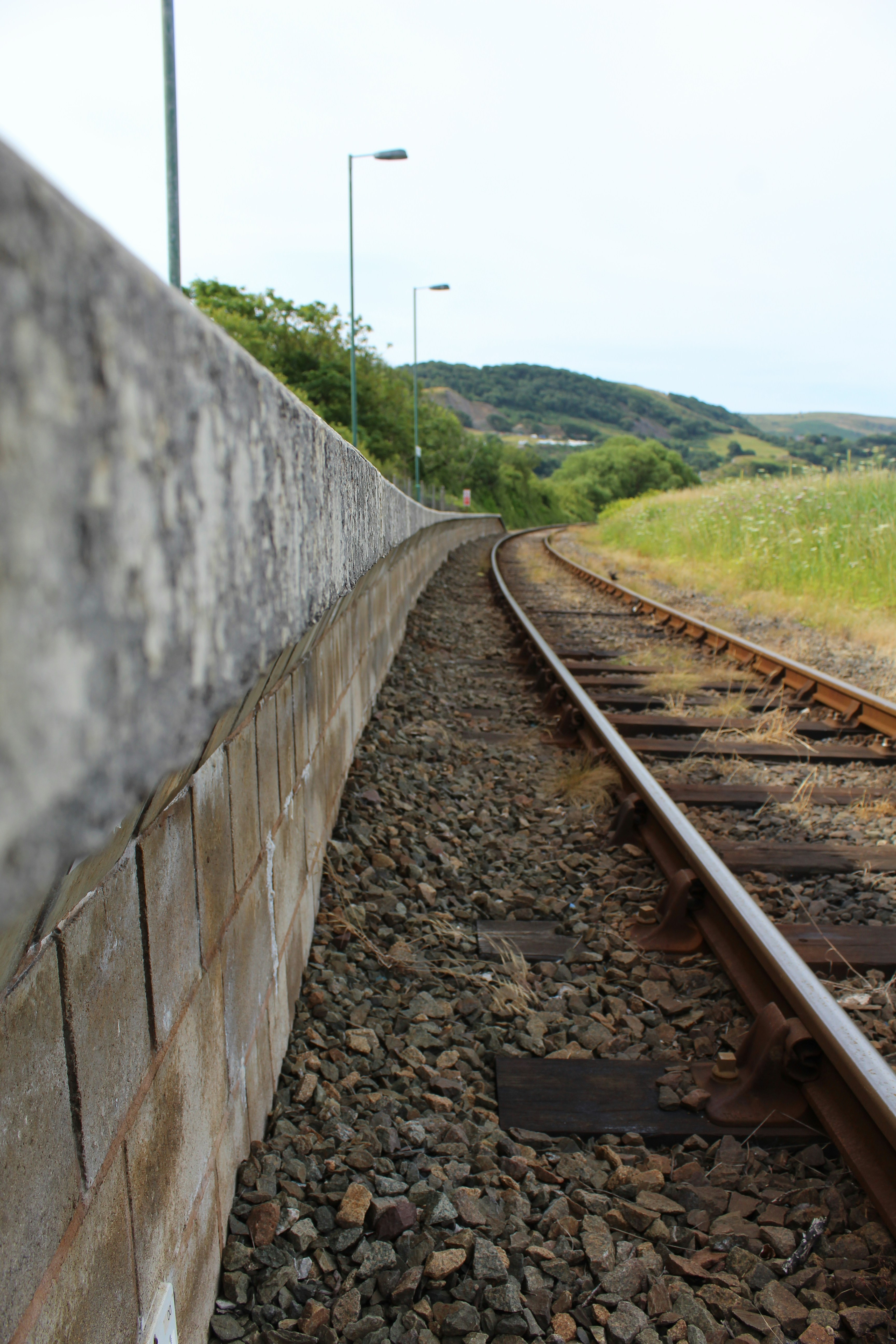 Vanishing Rails: A Quiet Descent Toward Distant Hills