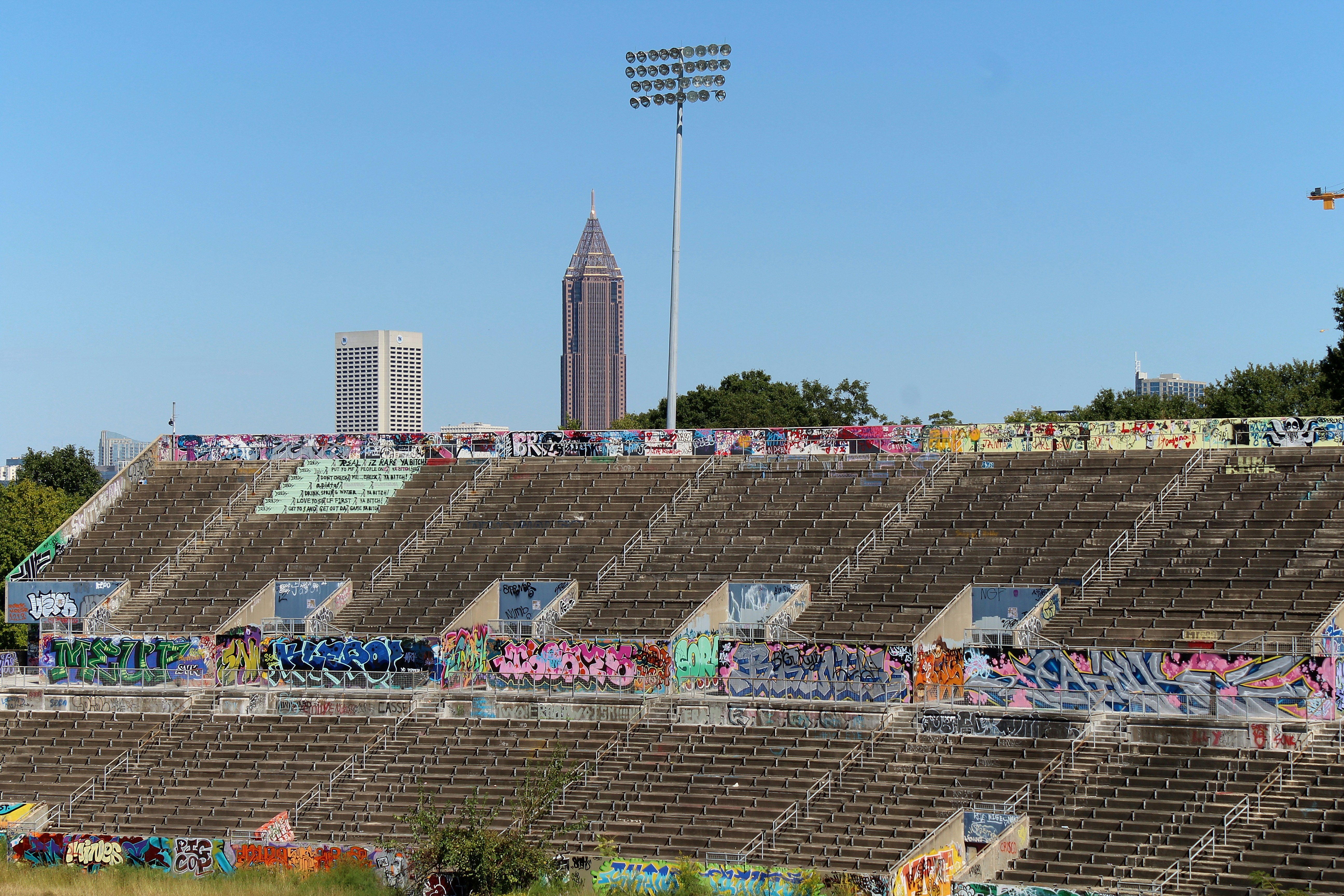 A stadium with graffiti on the side of it photo – Free Usa Image on ...