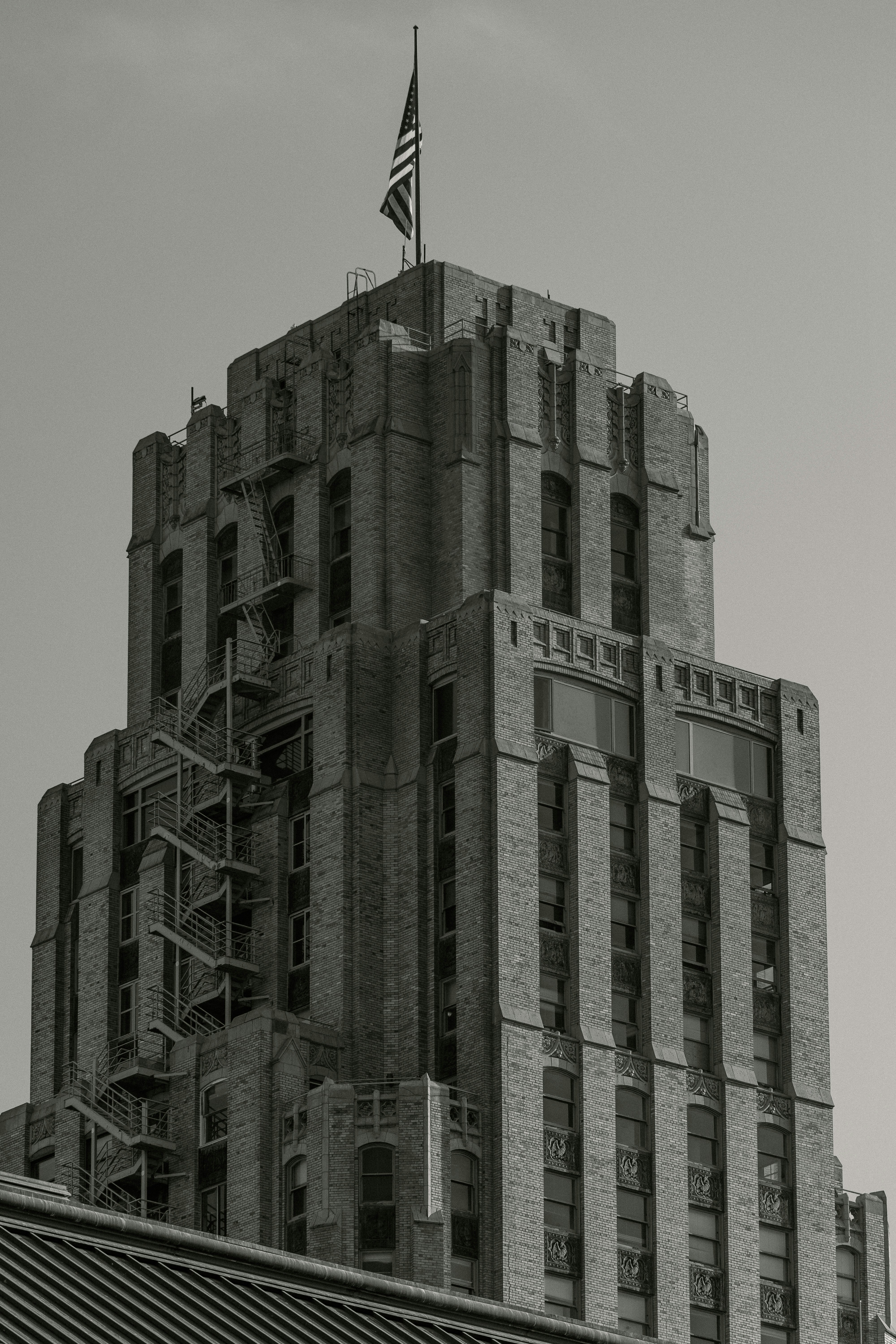 Flagcrest Tower: a stoic brick sentinel under a pale sky