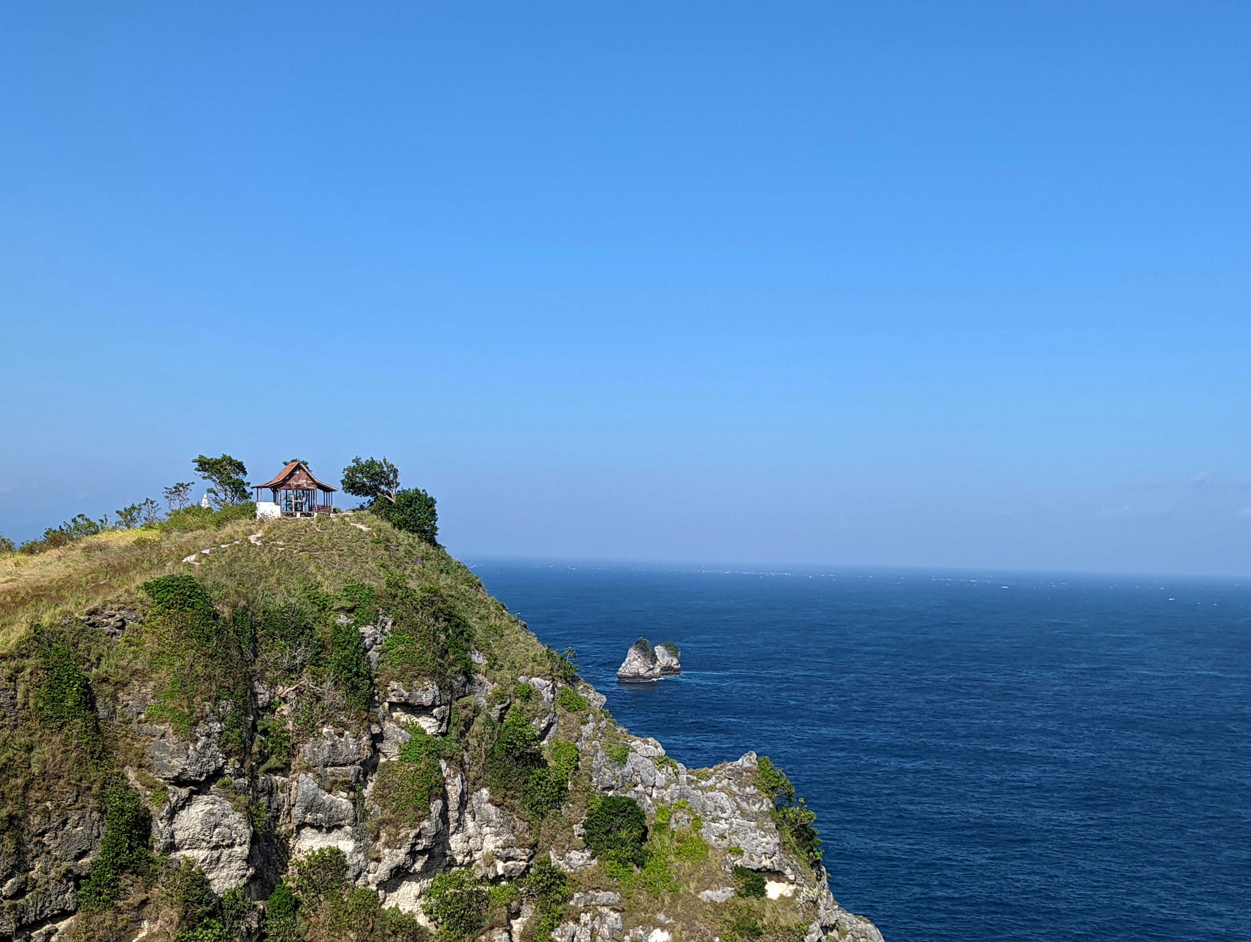 Pagoda on the Edge: A Cliffside Vista Over the Open Sea