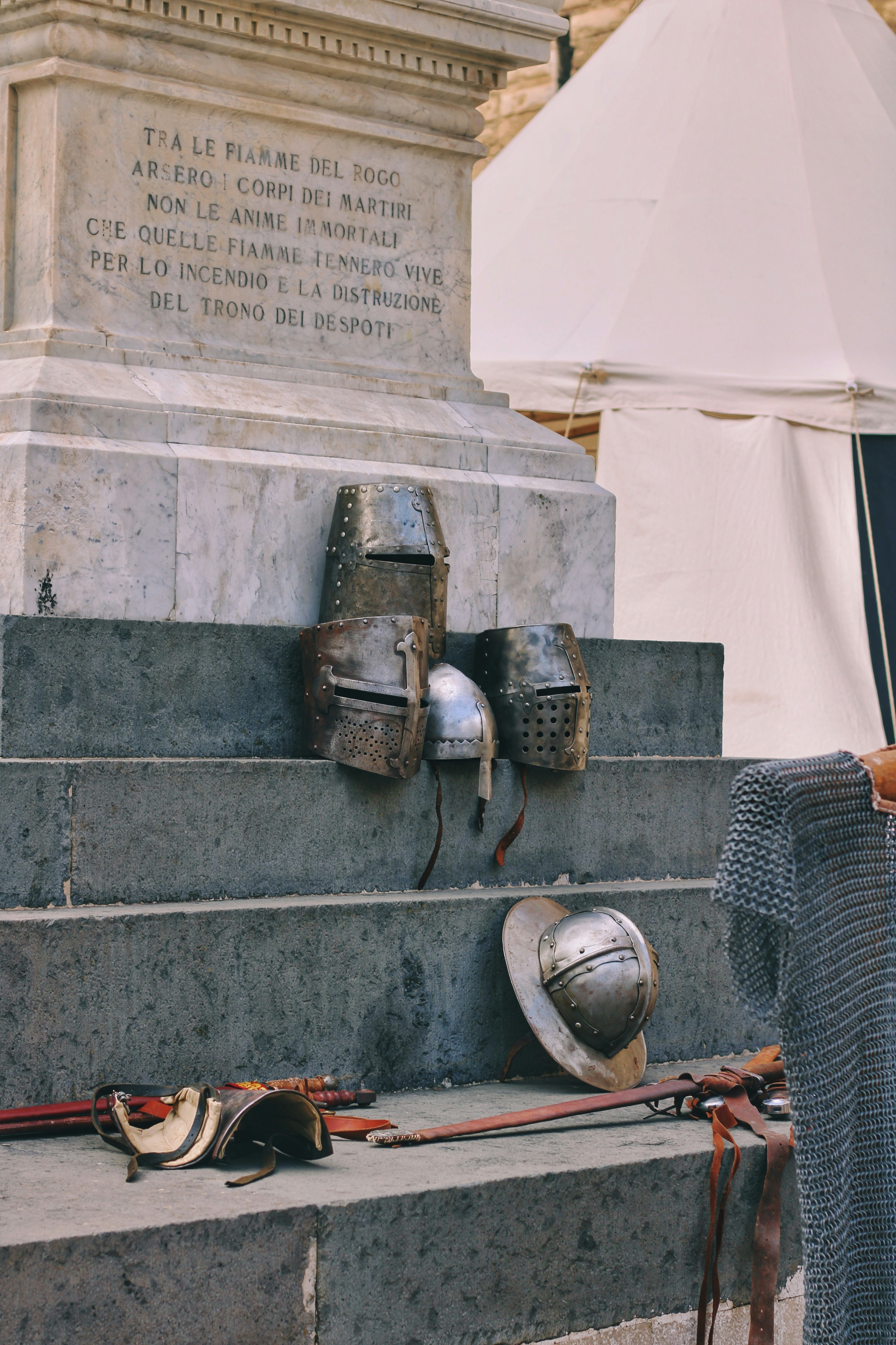 Armor on the Steps: Timeworn Helms Guard a Quiet Monument