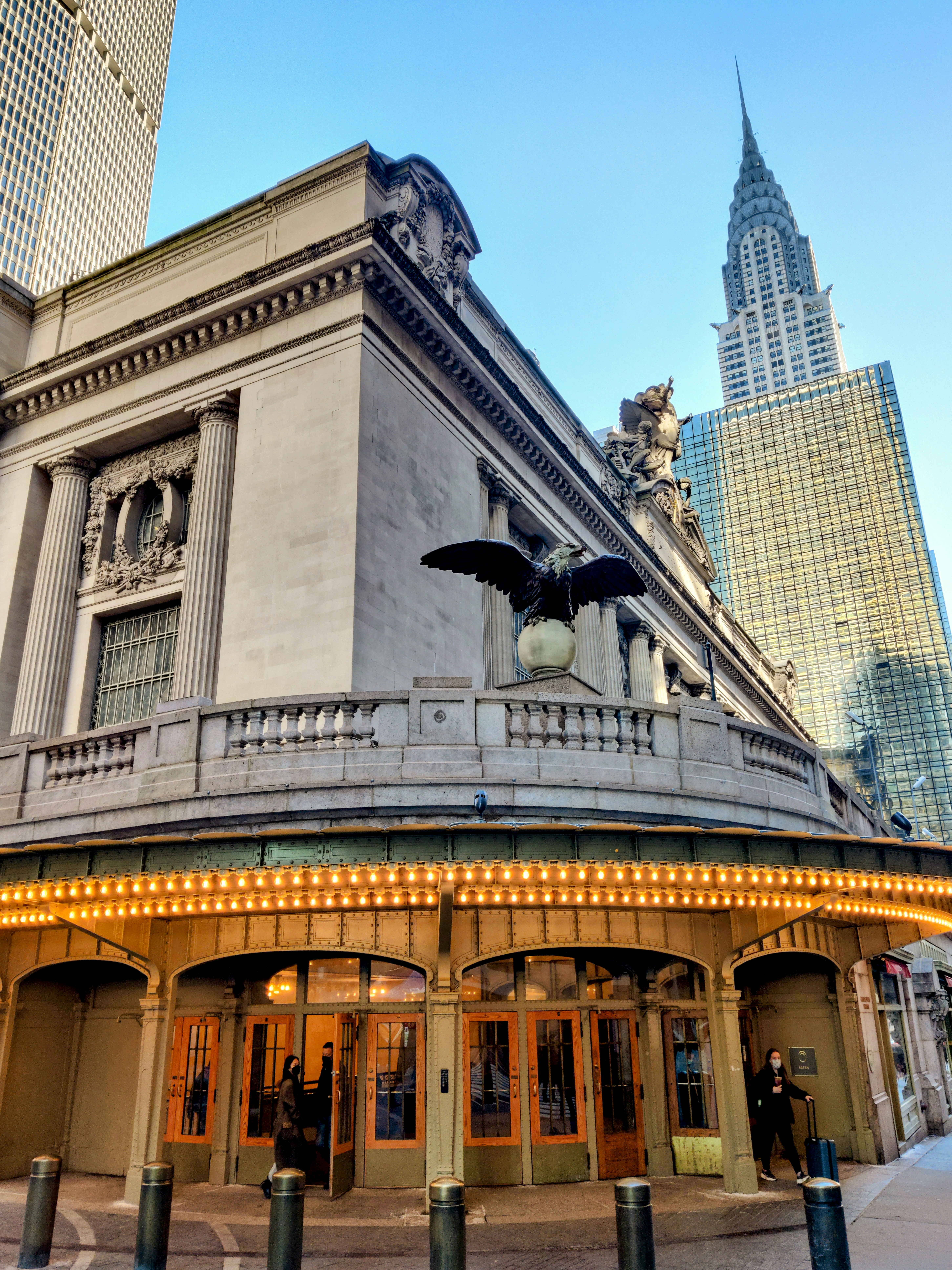 City Guardians over the Orpheum: A Winged Sentinel Above Neon Arches