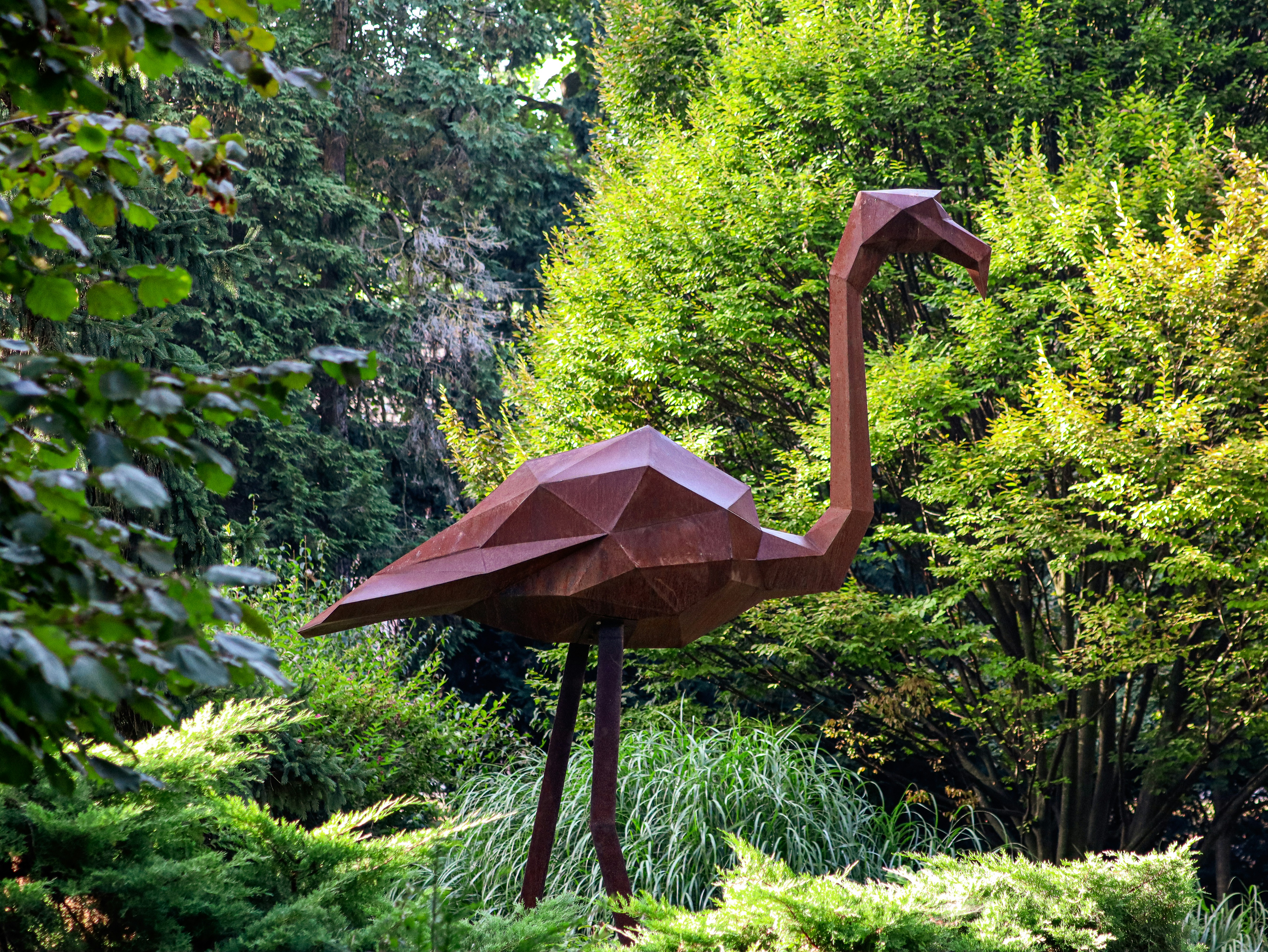 Polygonal Flamingo in a Lush Garden