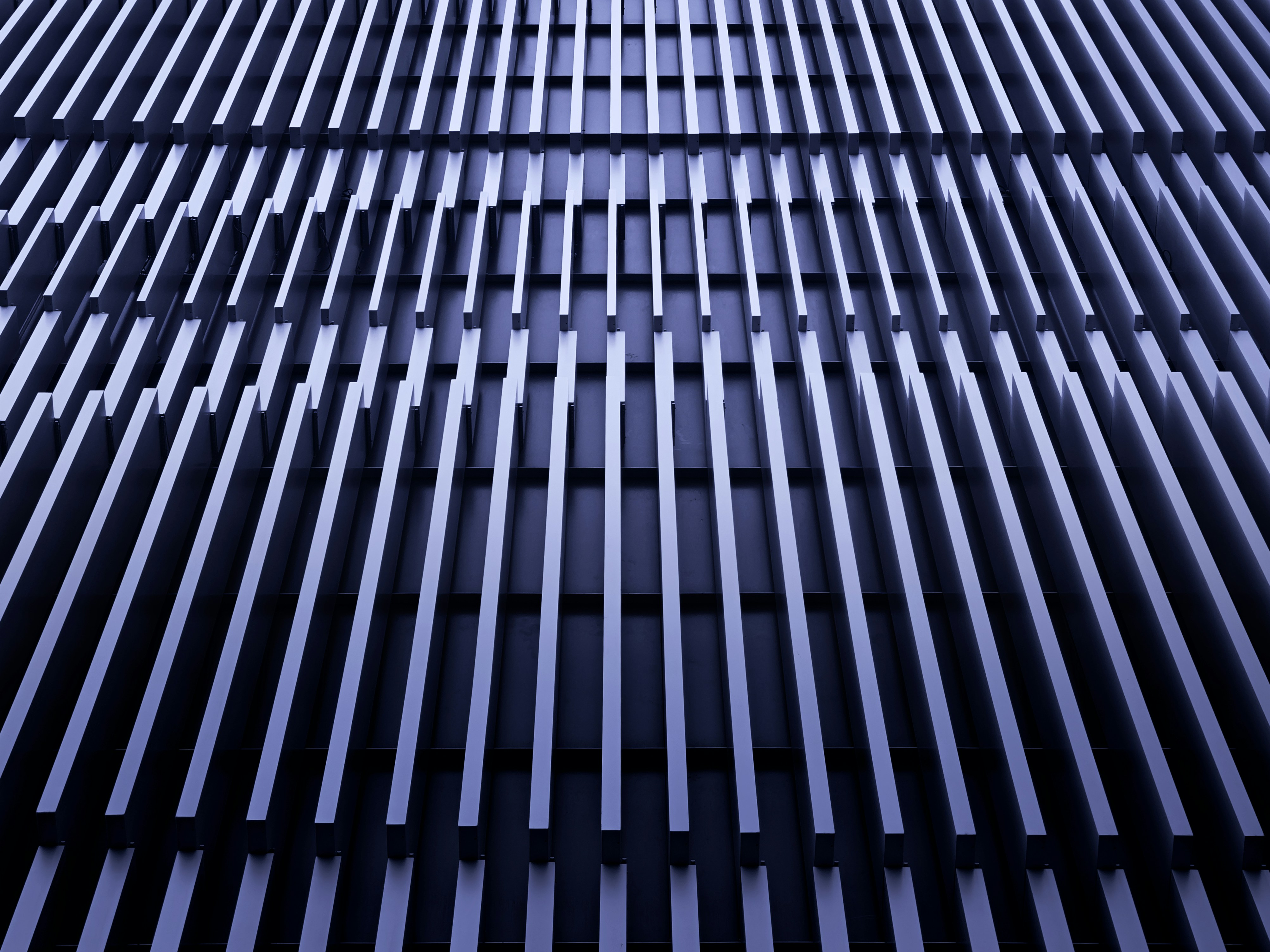 A close up of a building with vertical lines photo – Free Nanyou Image ...