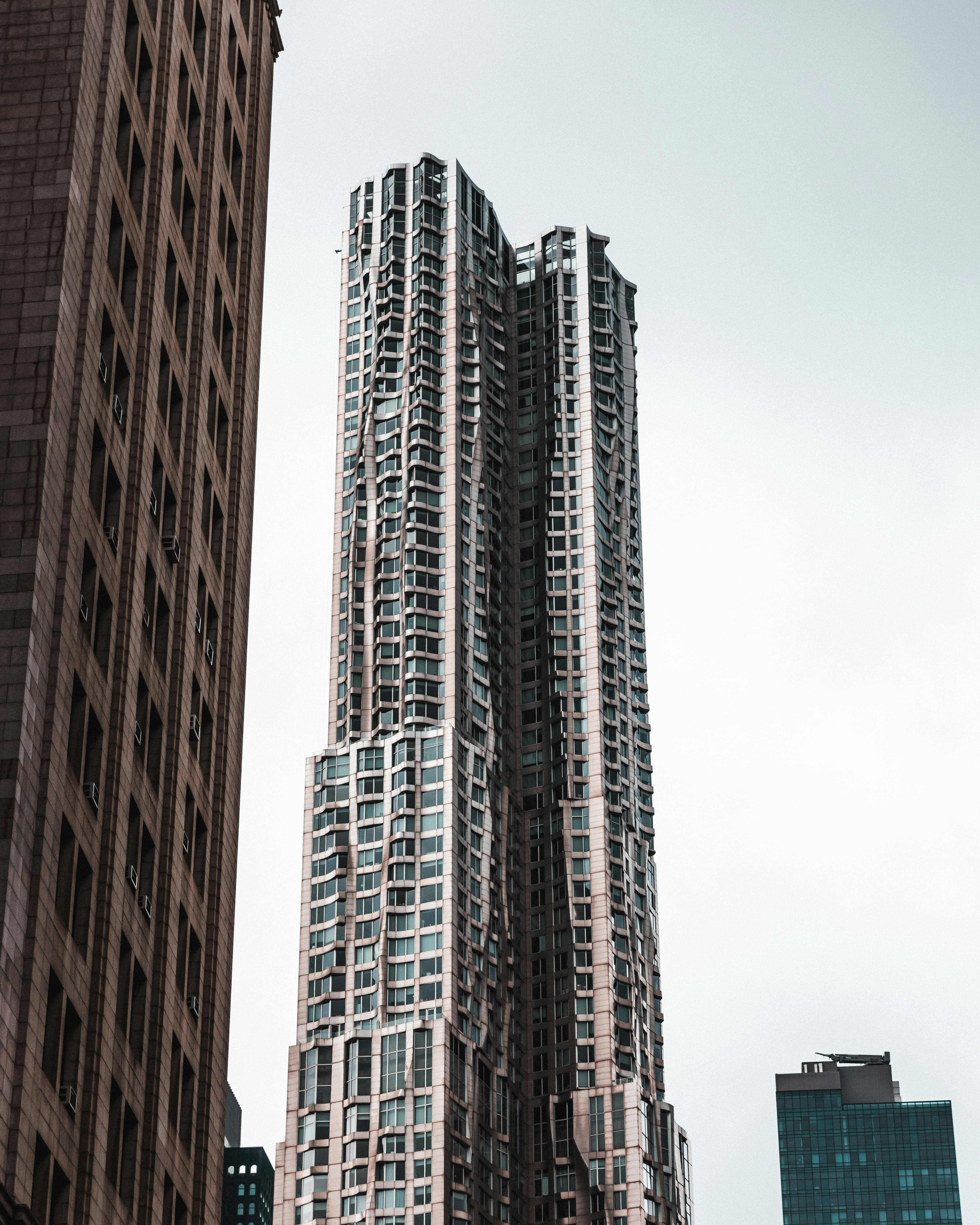 A very tall building in the middle of a city photo – Free New york city ...