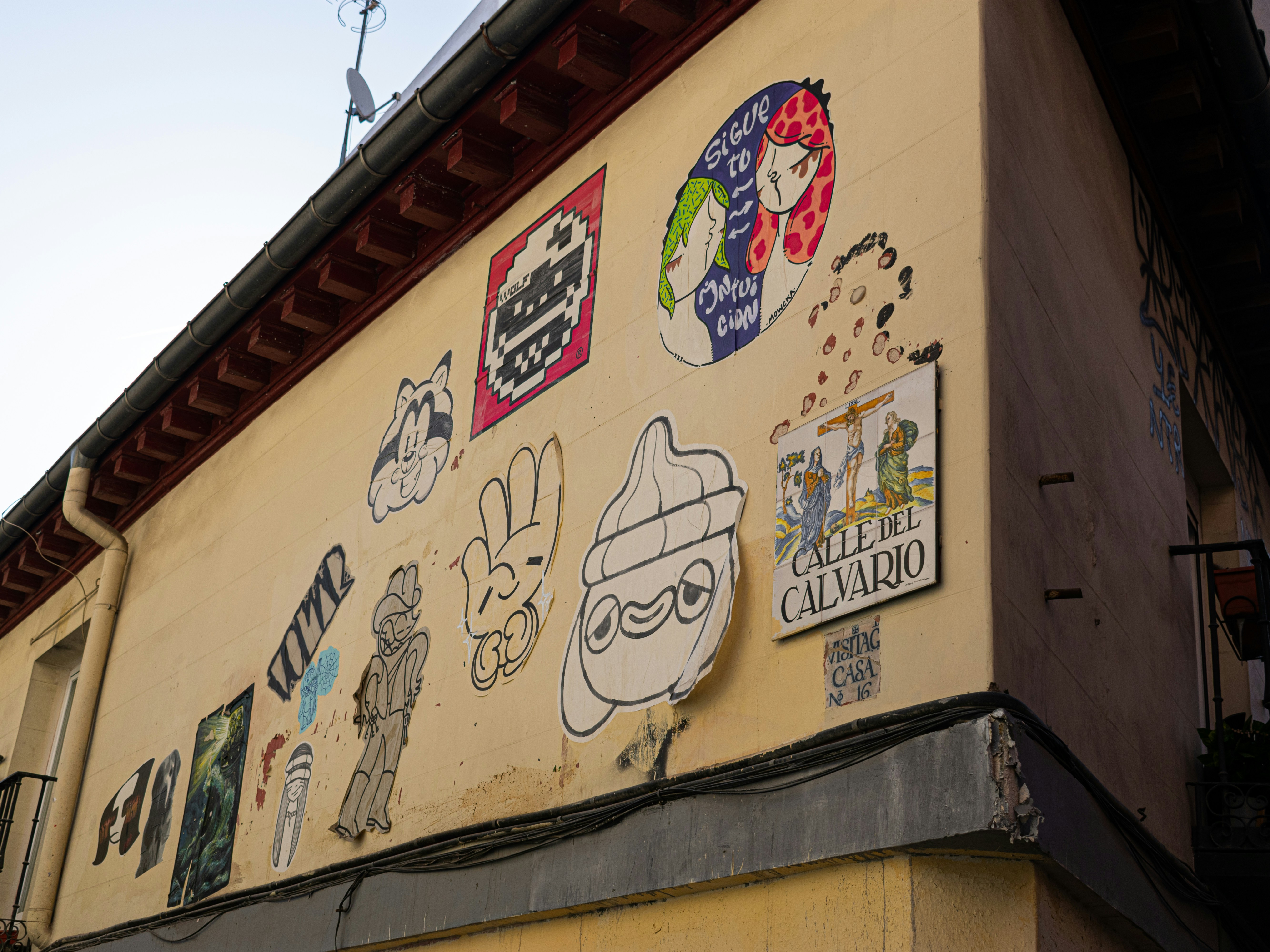 Roundel of Color: A Sunlit Wall of Cartoons and Graffiti