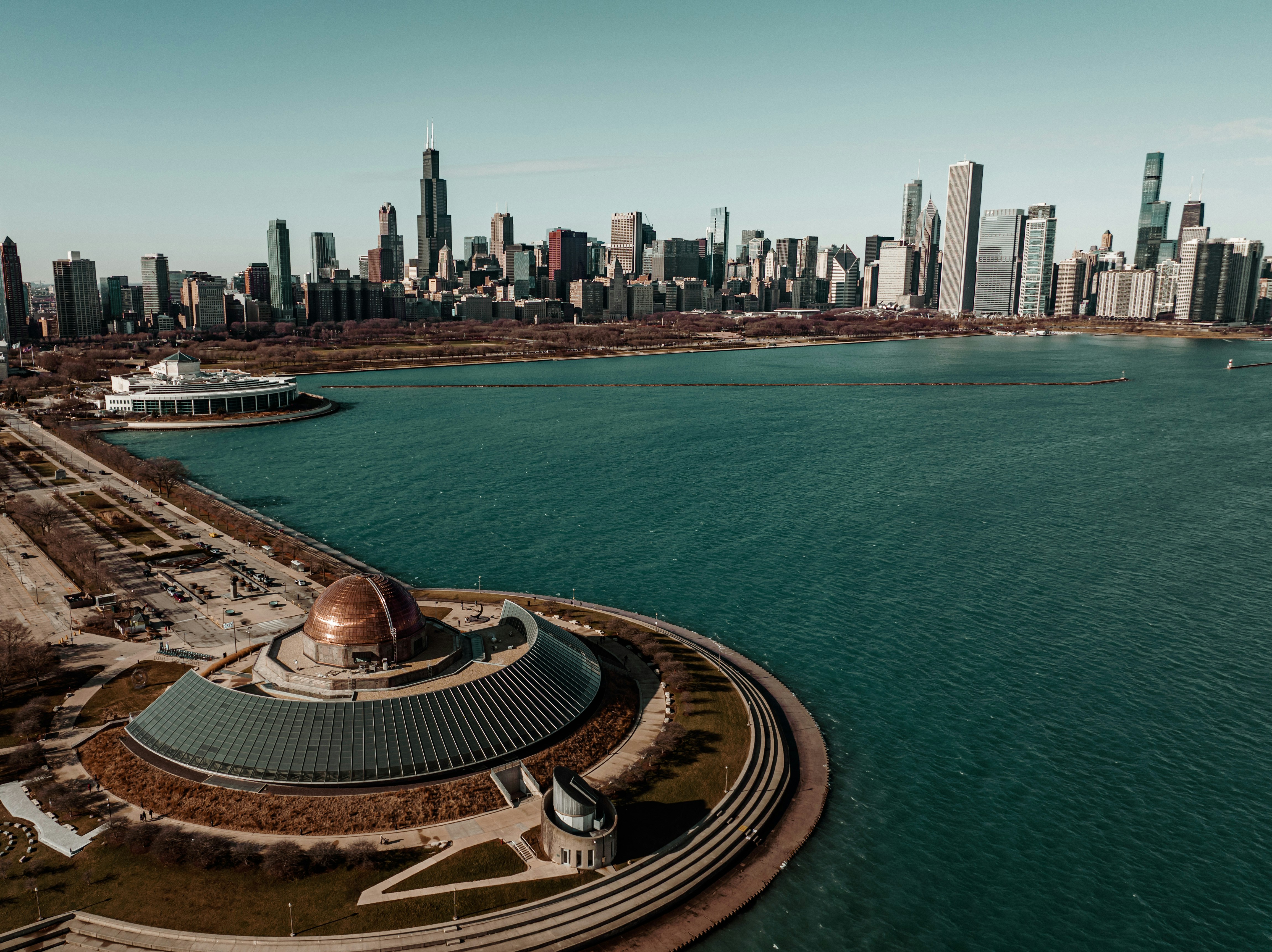 Dome at the Curve: A Waterfront Promenade Framing a Glass Skyline