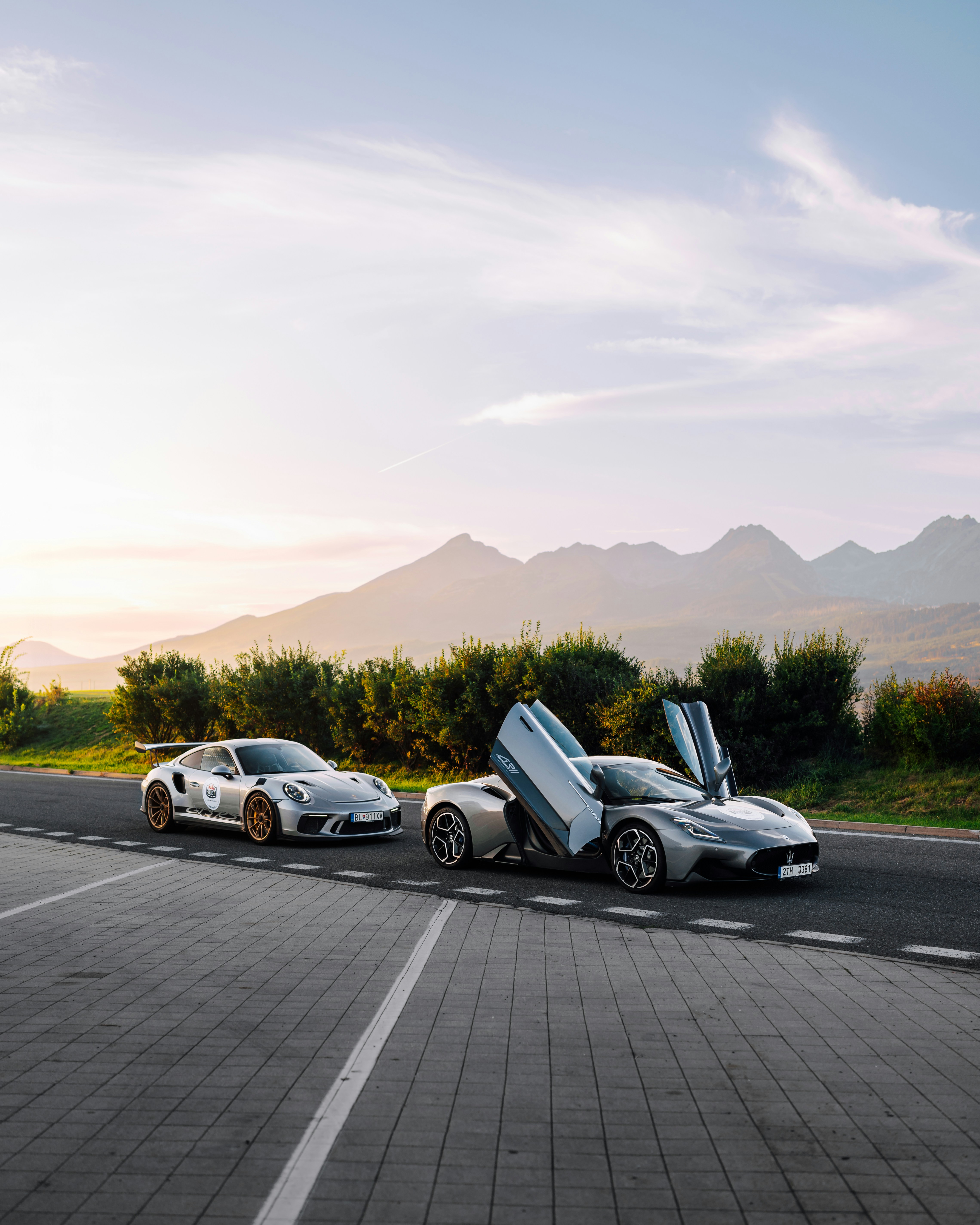 A couple of cars parked on the side of a road photo – Free Slovakia ...