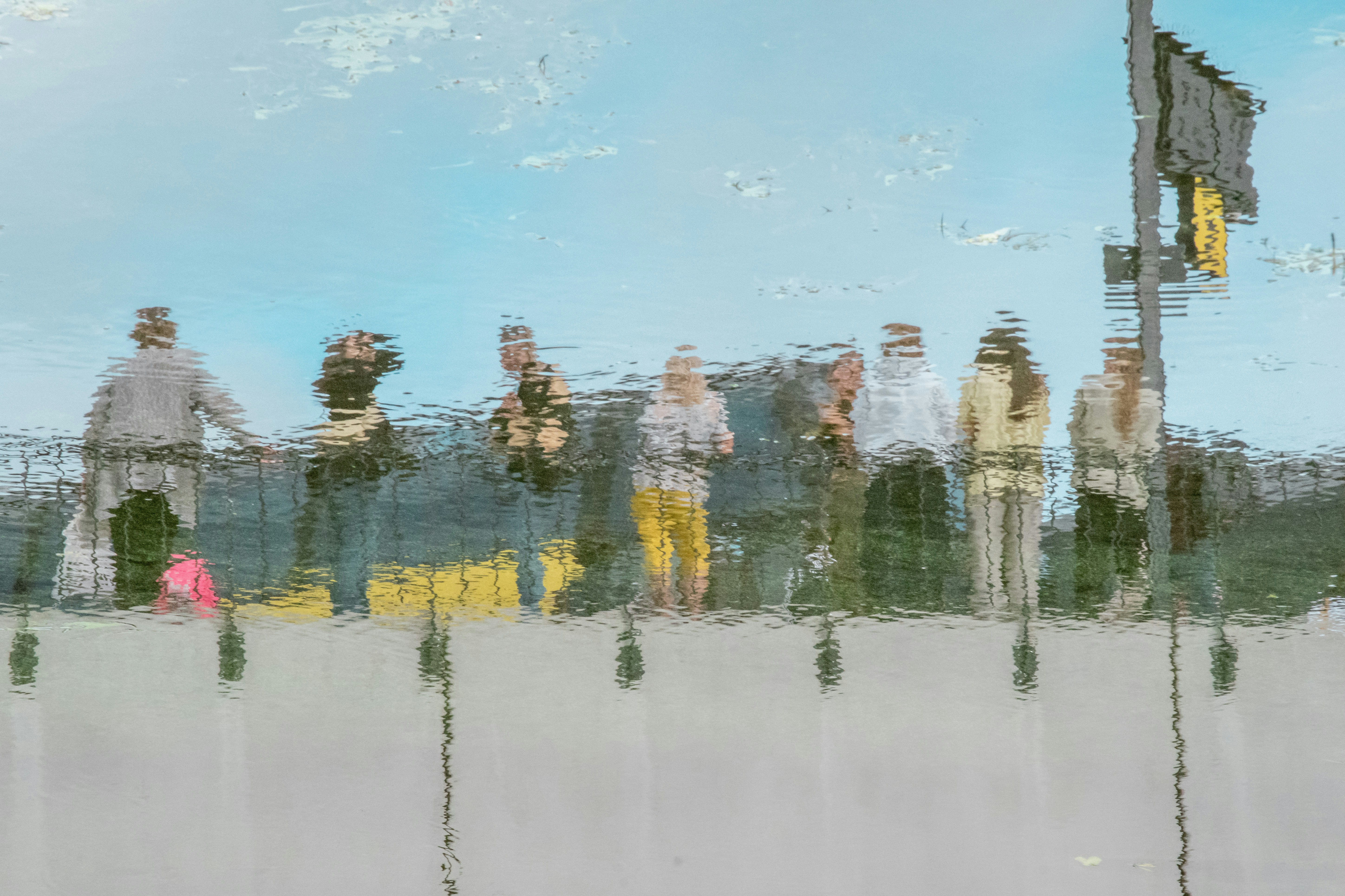 Reflection of a group of people in Riga.