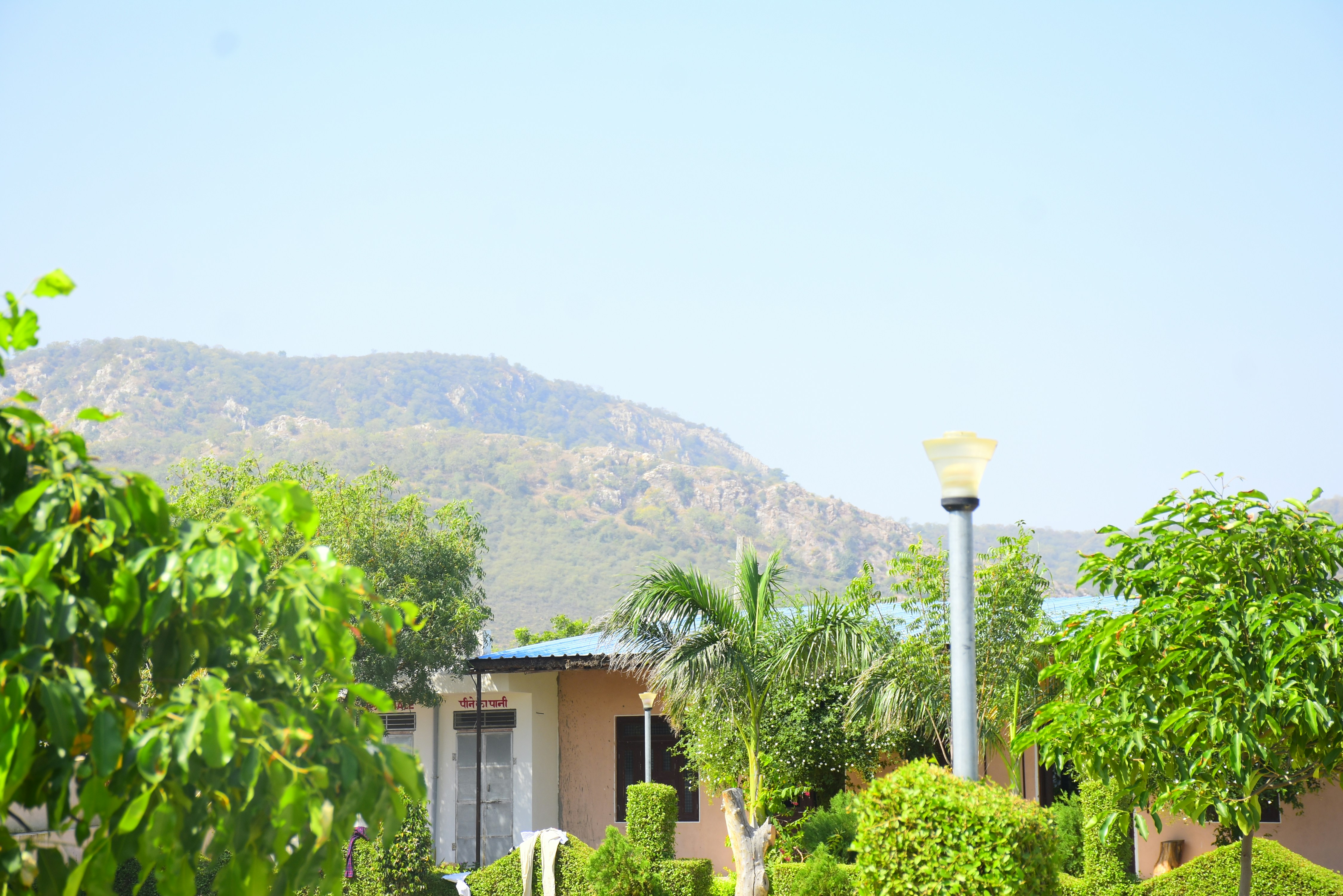 a house with a mountain in the background