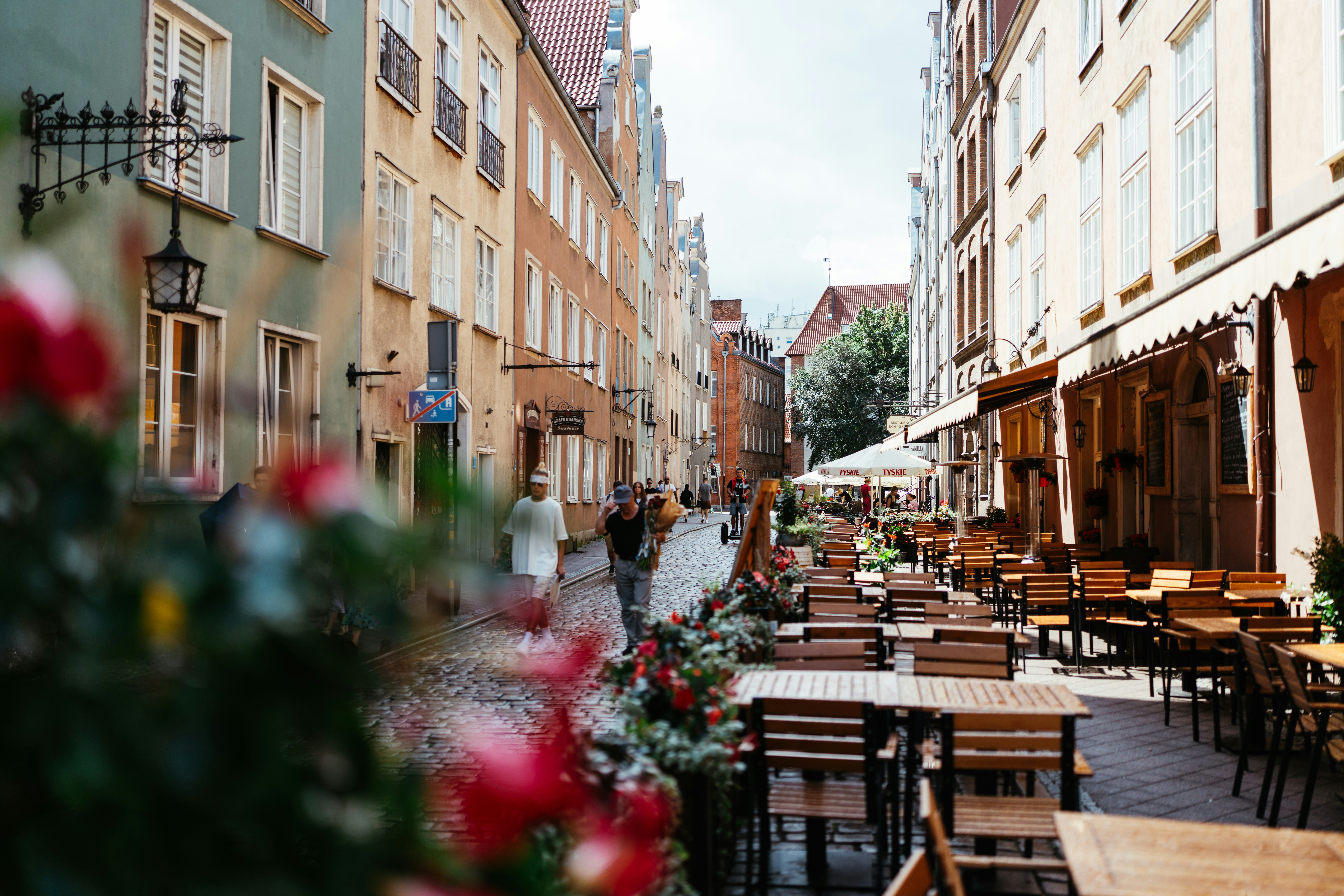 Alfresco Lane: Cobblestones, Café Tables, and Sunlit Pedestrians