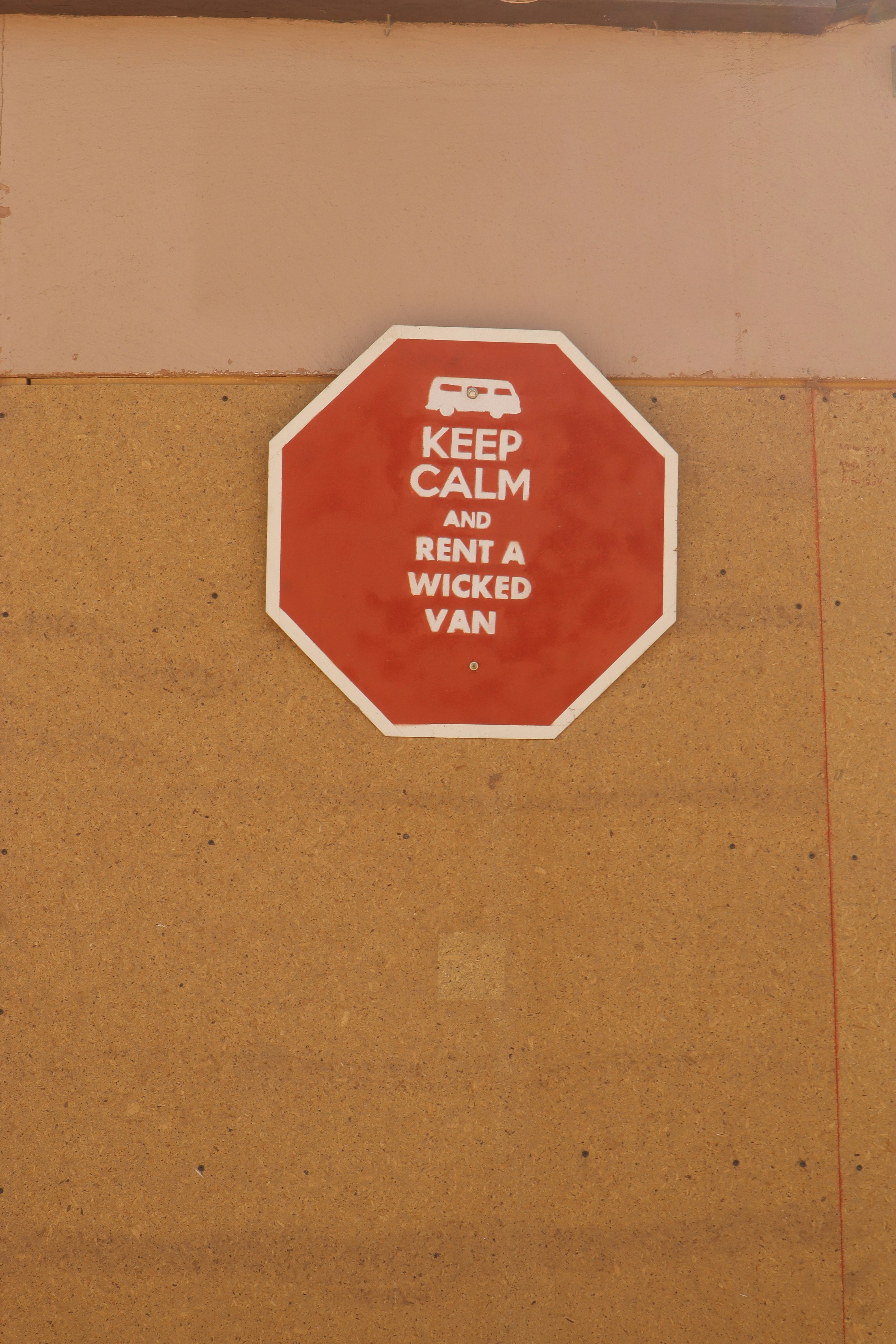 Red Octagon on Brick: Keep Calm and Rent a Wicked Van