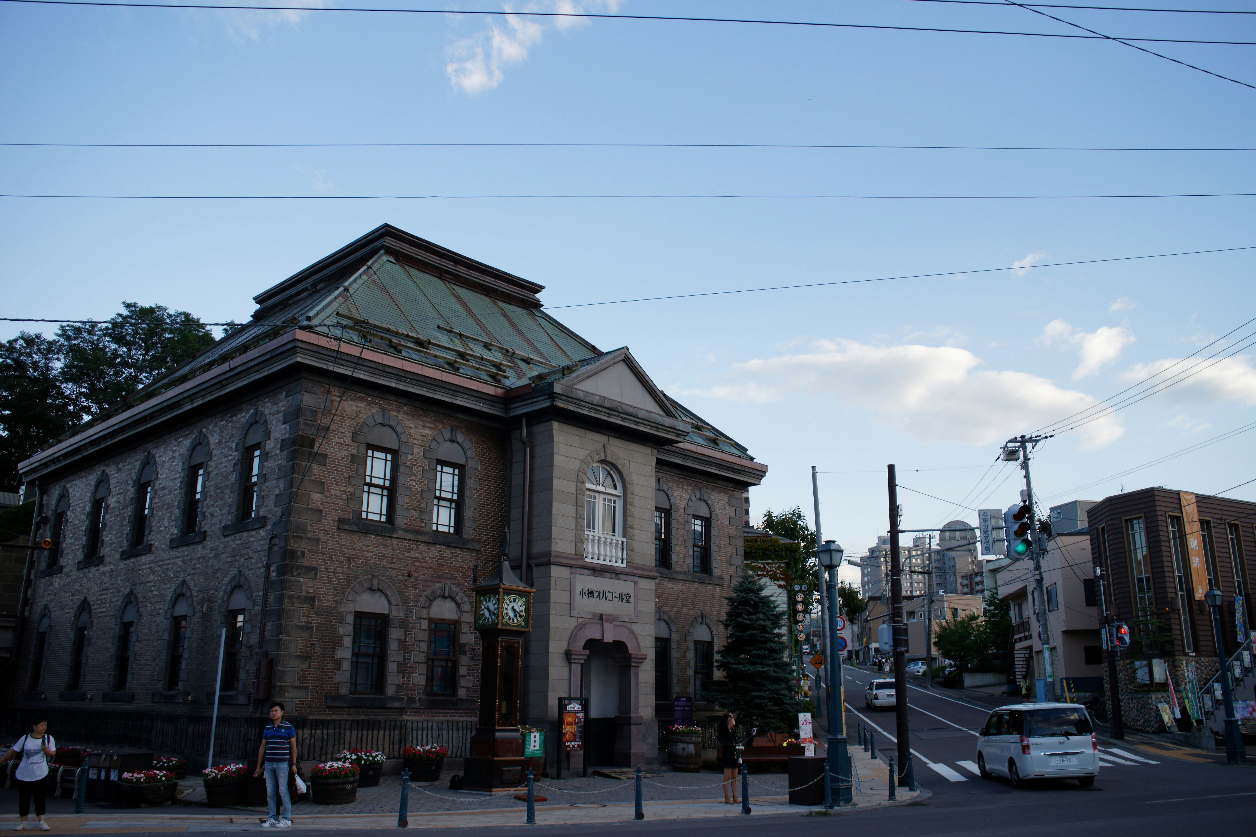Legacy Corner: A Historic Brick Building Framing a Quiet, Modern Street