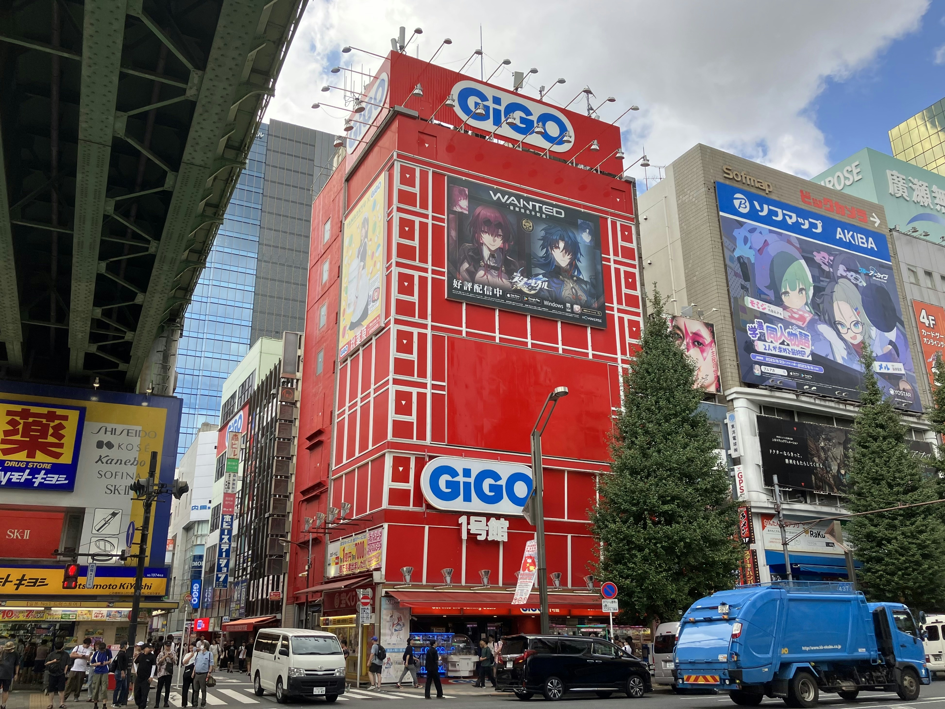 A large red building with a giant advertisement on it's side photo ...