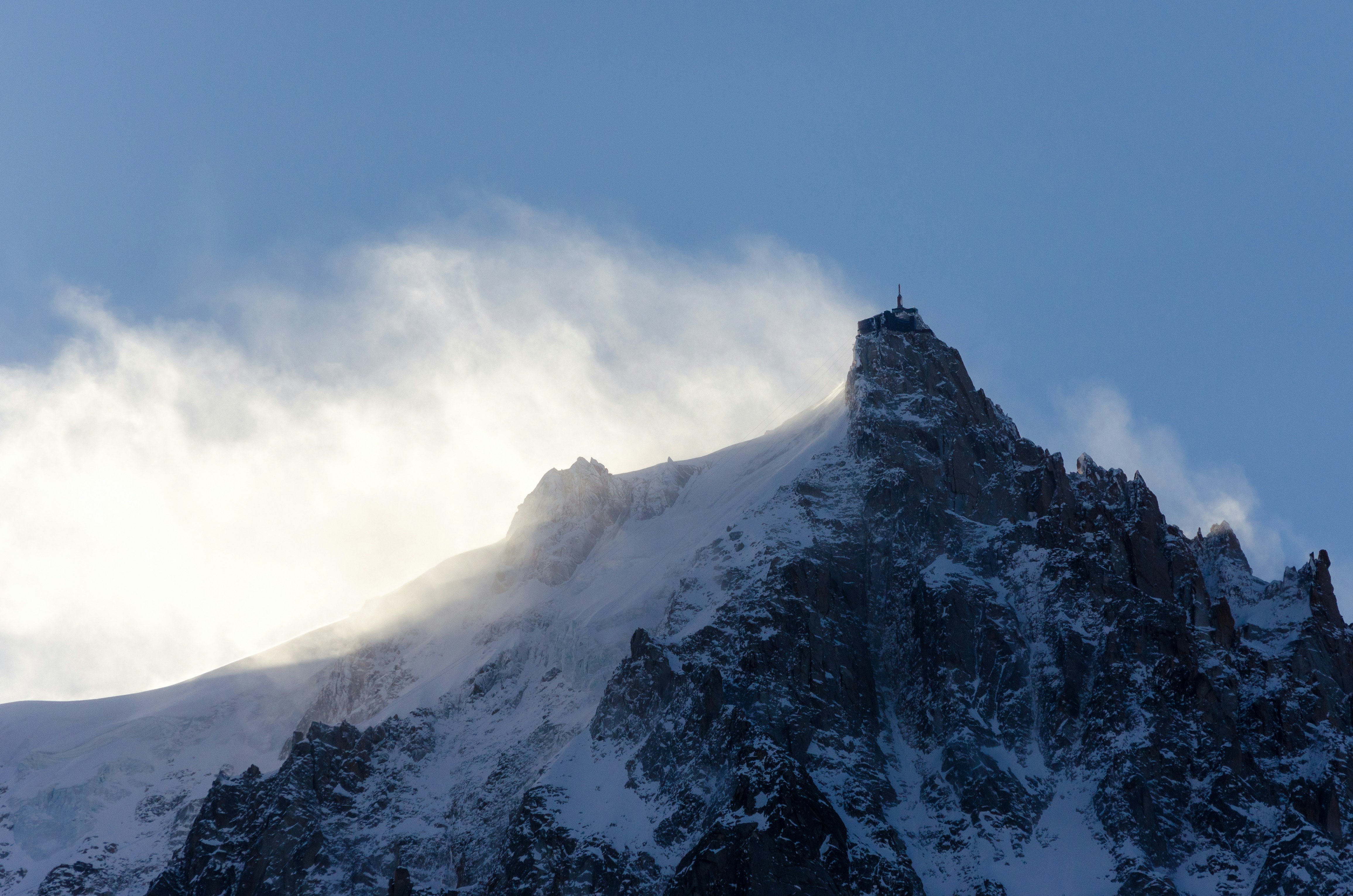 A snow covered mountain with a sky background photo – Free Chamonix ...