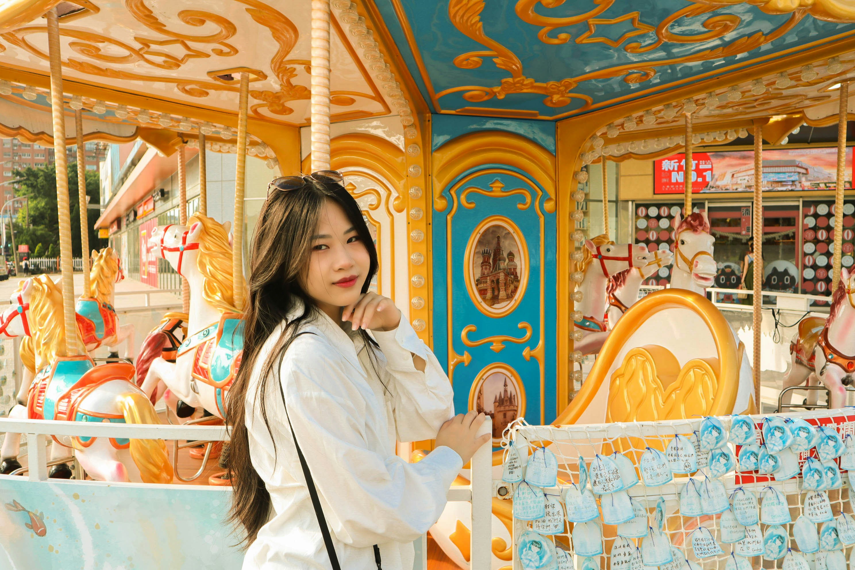 Carousel Confidante: A Quiet Moment Amid Painted Whimsy