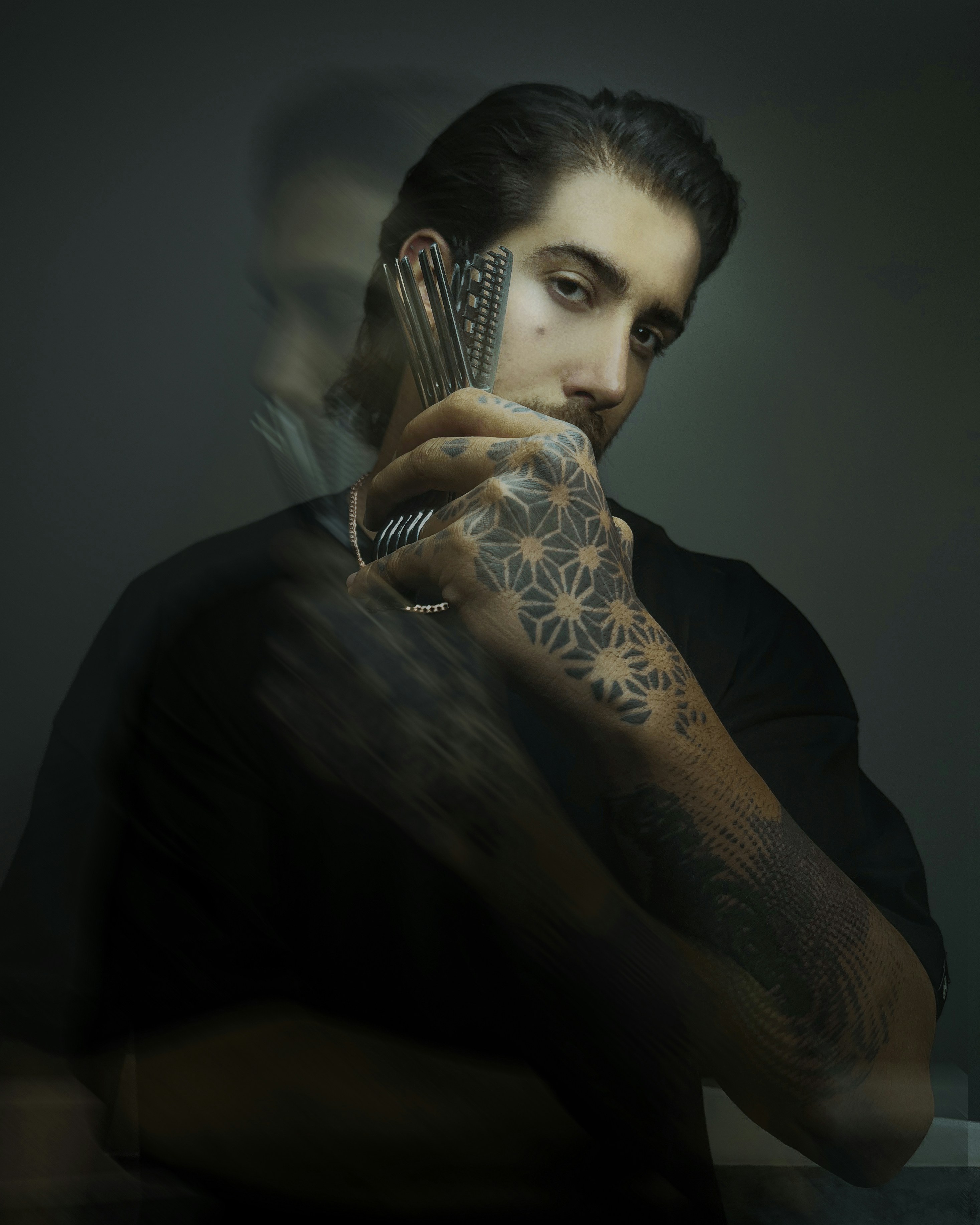 A man holding a cell phone up to his face photo – Free Mashhad Image on ...