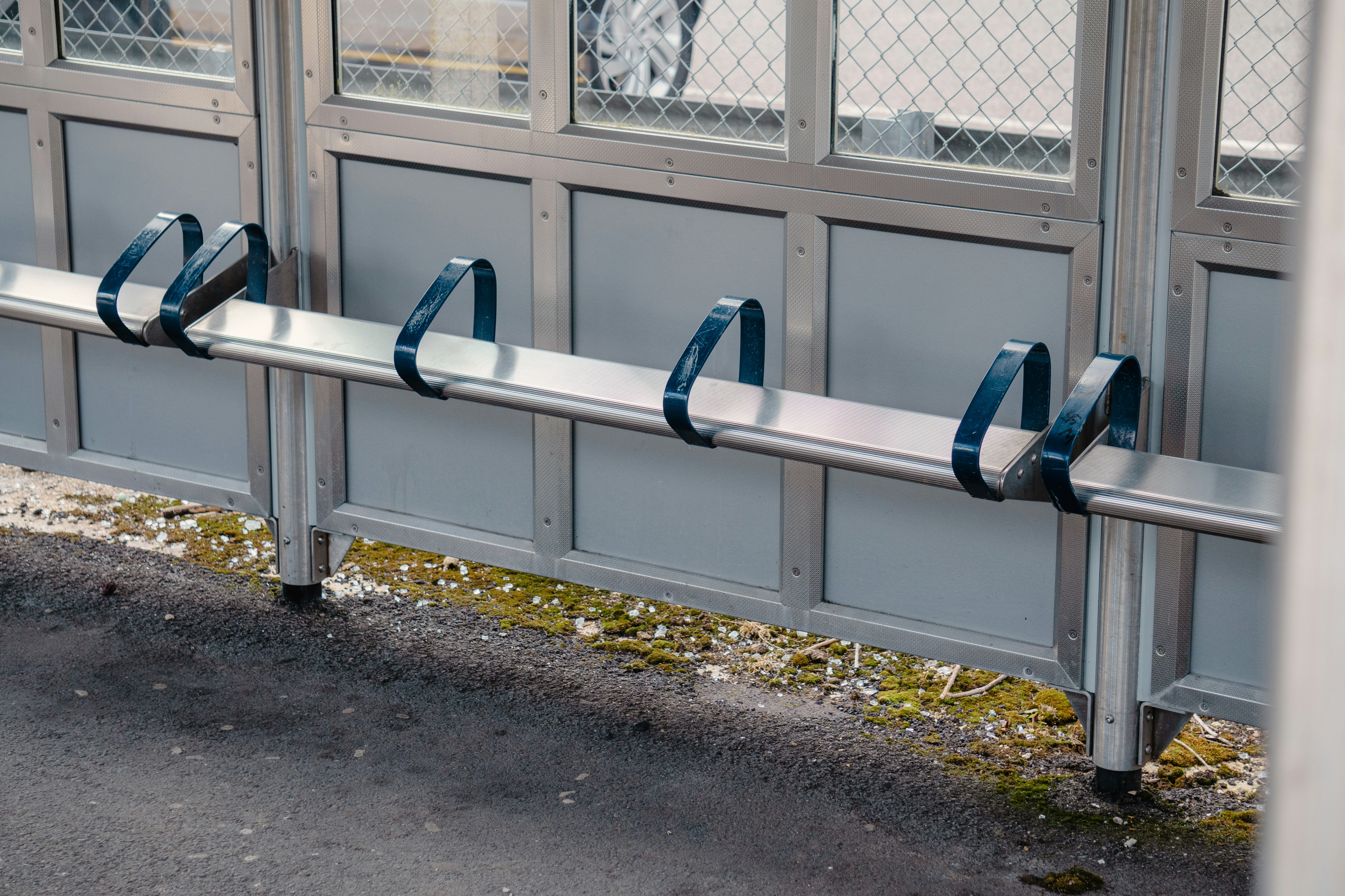 Blue Straps on Steel Rails: A Minimalist Study of Repetition