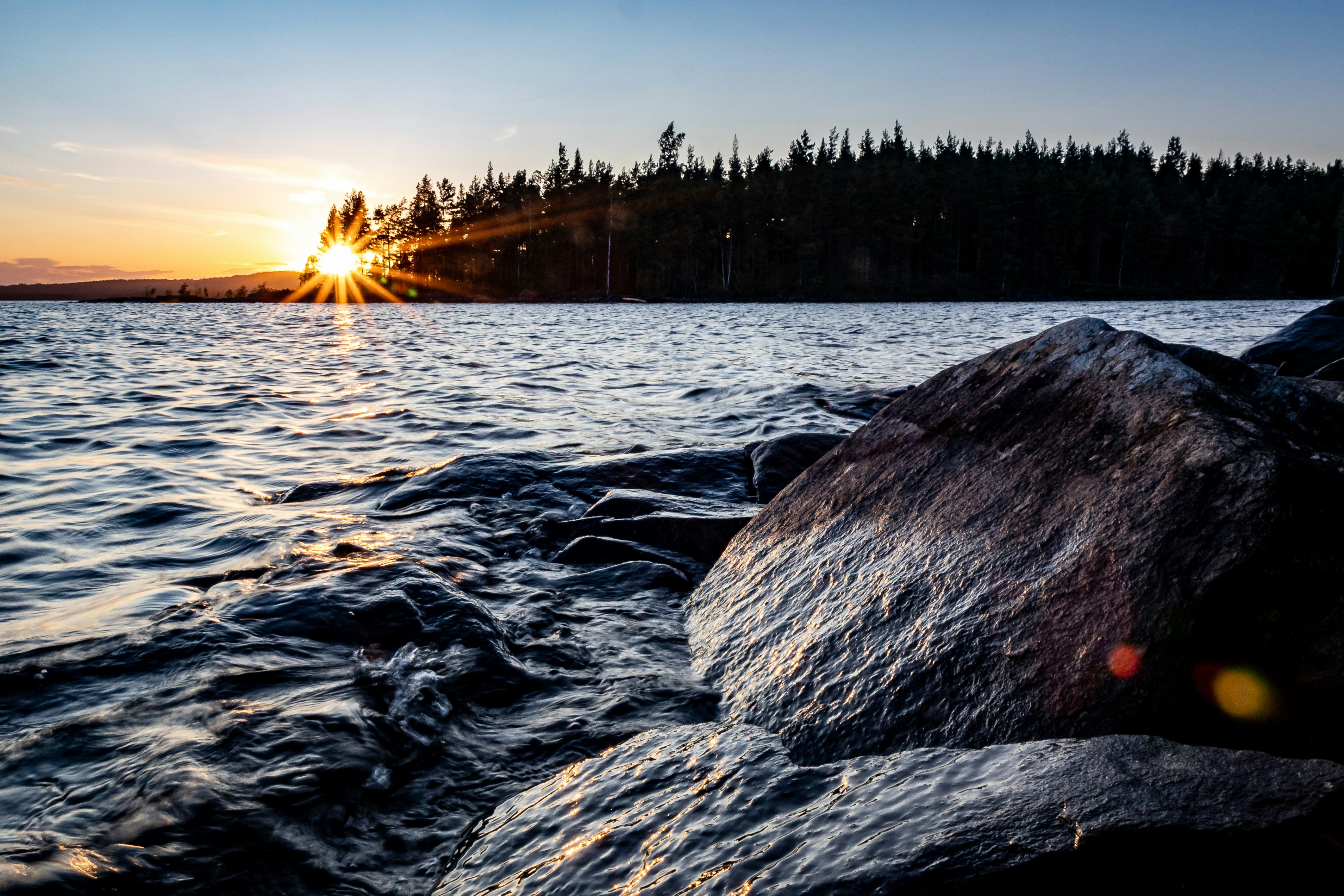 Sunburst over Granite Shore at Dusk