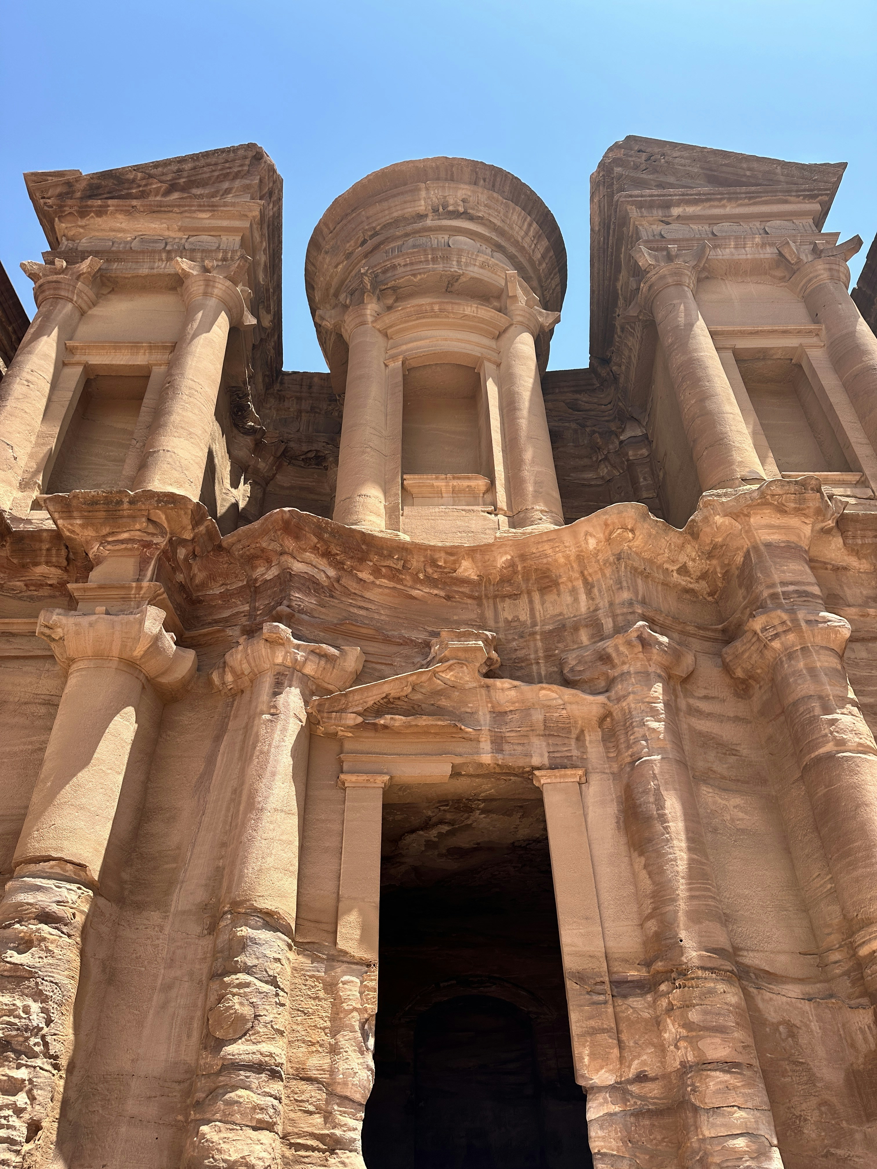 A very tall building with some very tall pillars photo – Free Petra ...