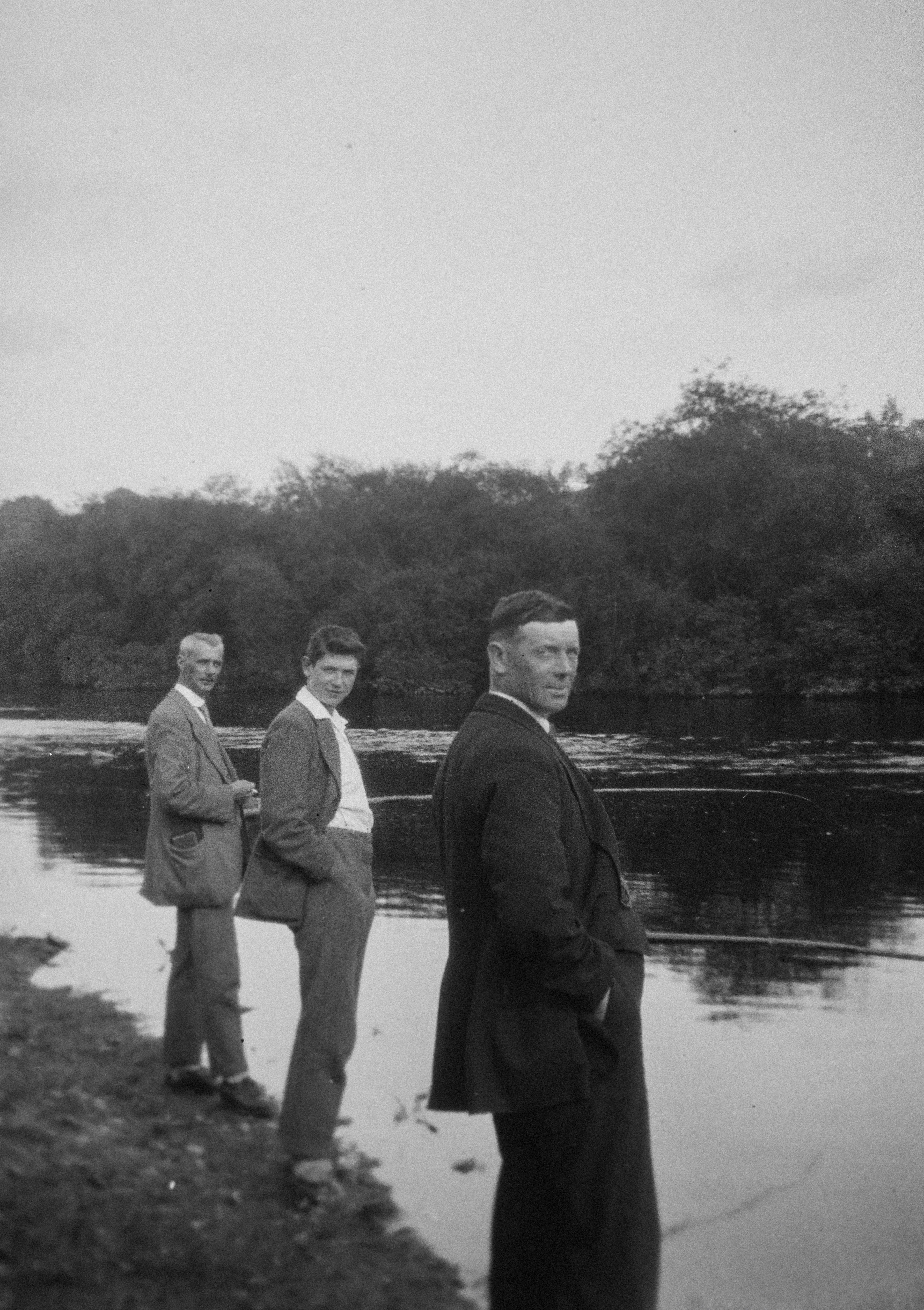 Riverside Quiet: Three Gentlemen in a Monochrome Midcentury Moment