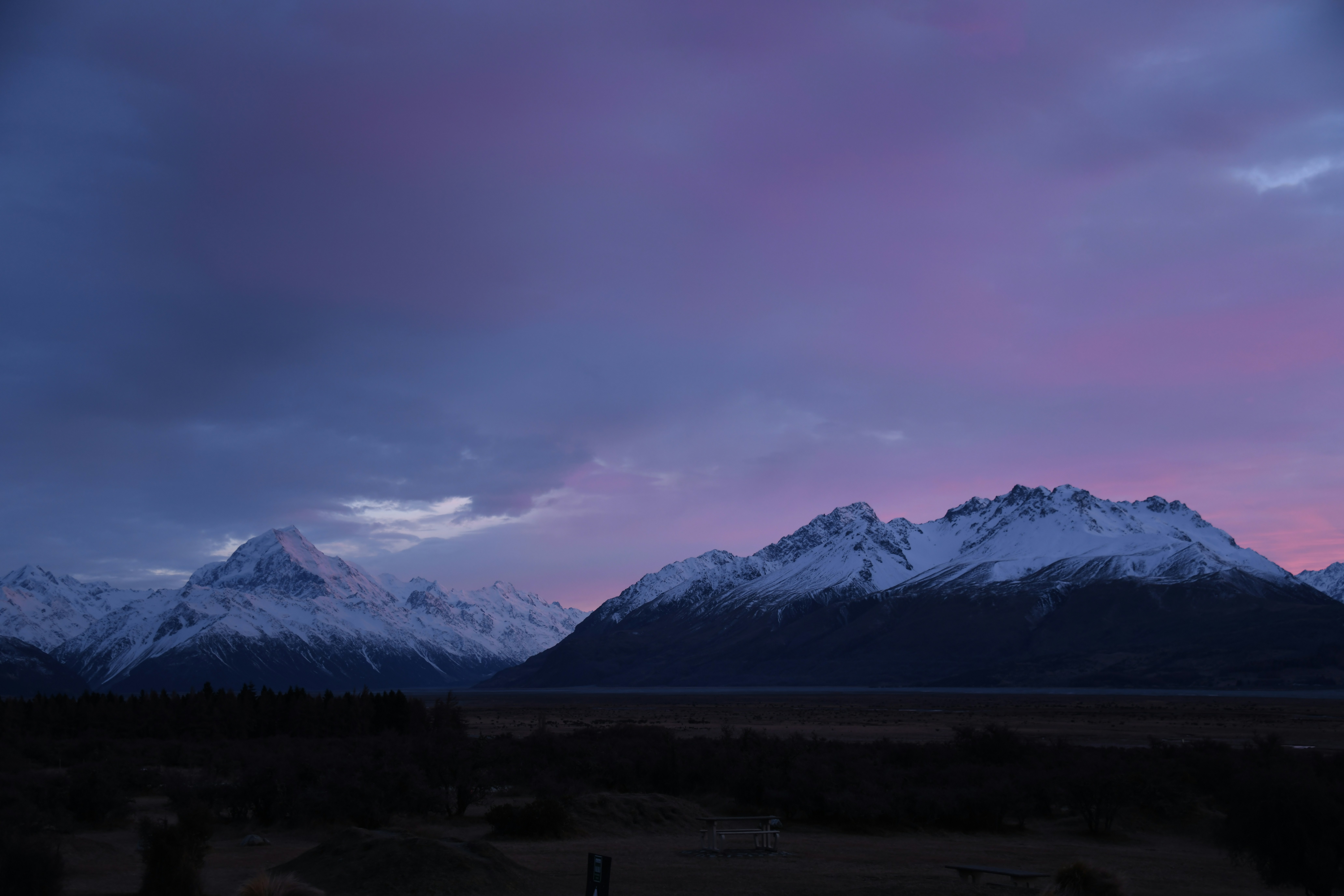Twilight Ridge: Snow-capped Peaks under a Velvet Sky