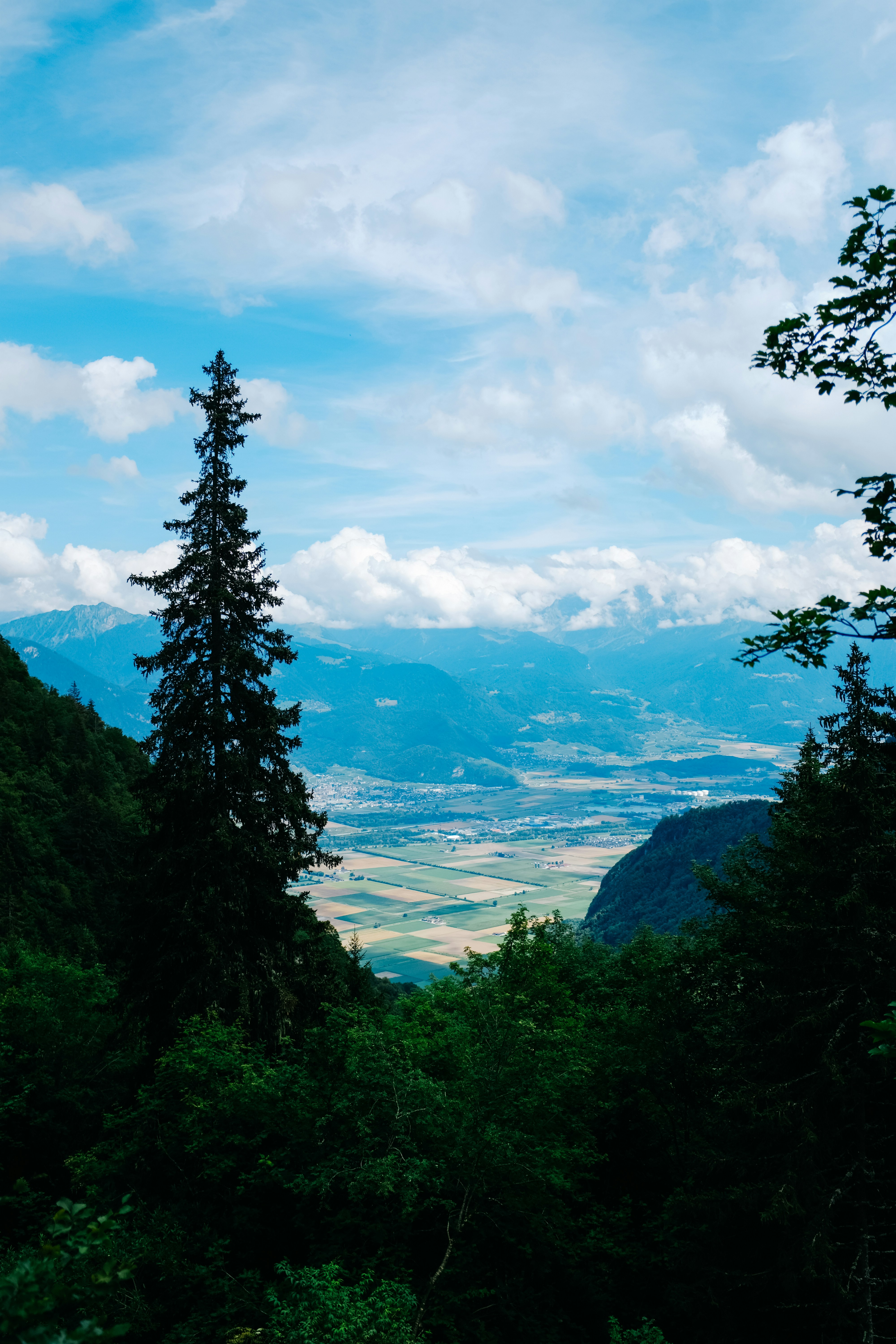 A view of a valley and mountains from a distance photo – Free Nature ...
