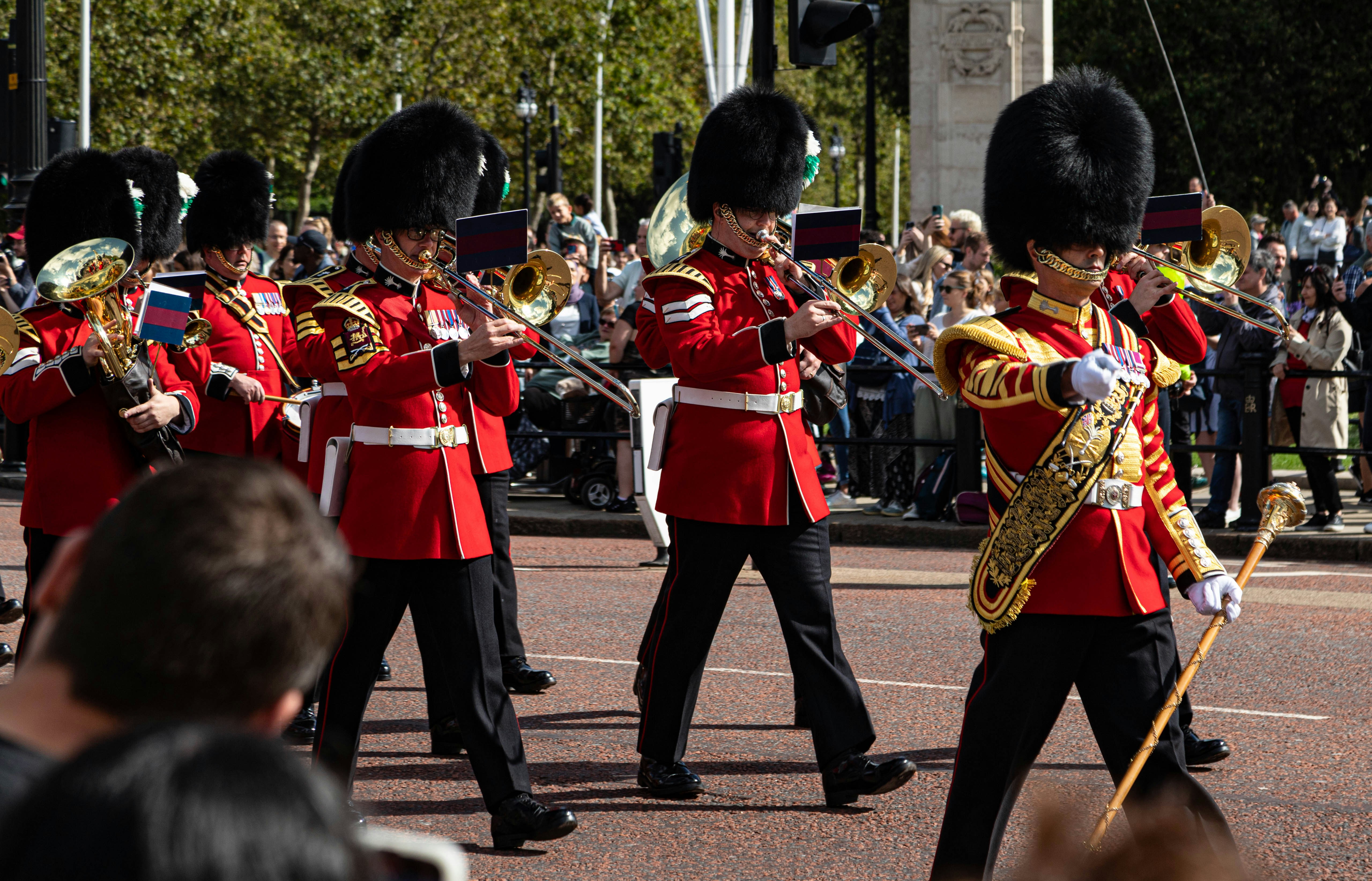 A group of men in uniform marching down a street photo – Free London ...