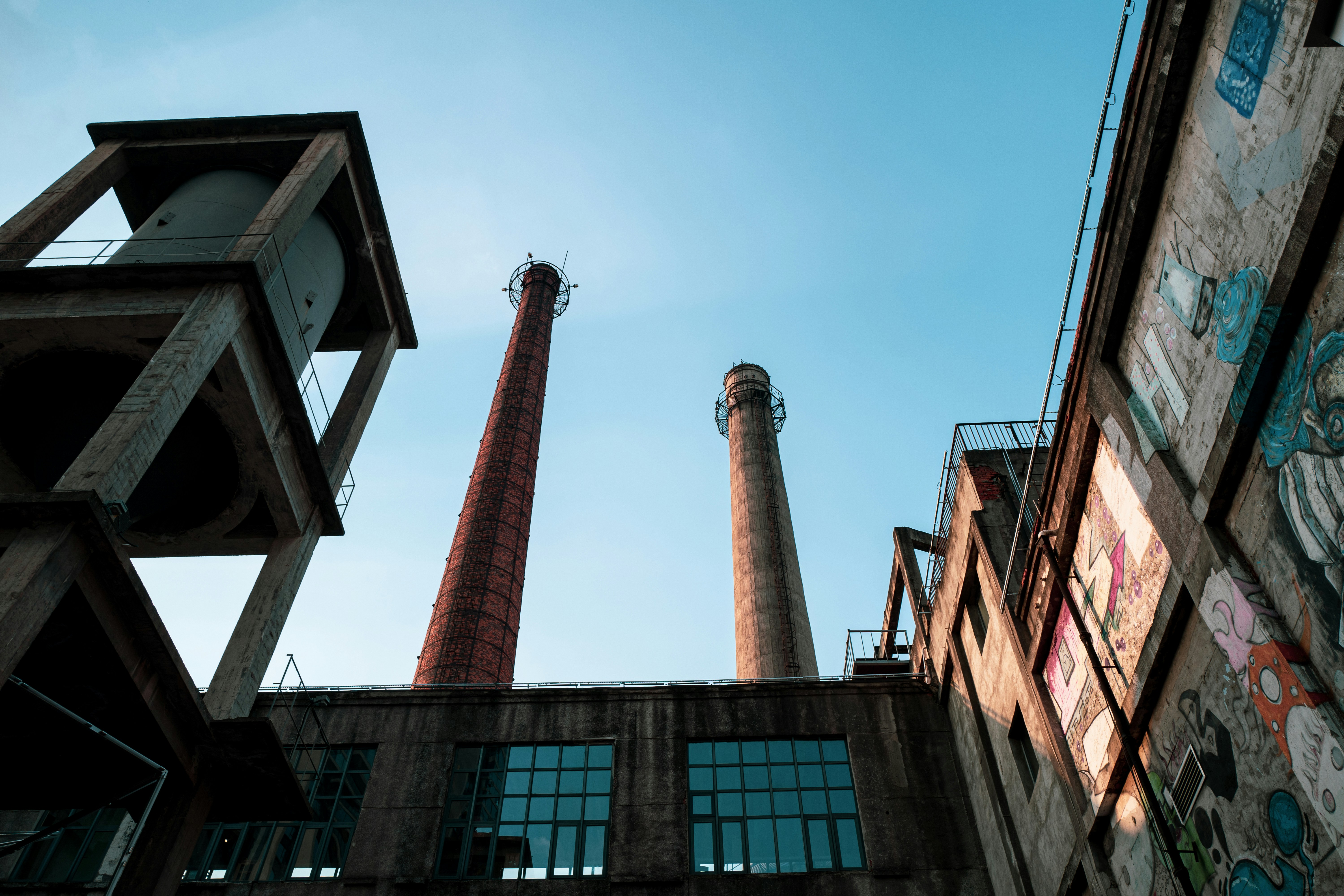 A tall brick building with two towers next to it photo – Free ...