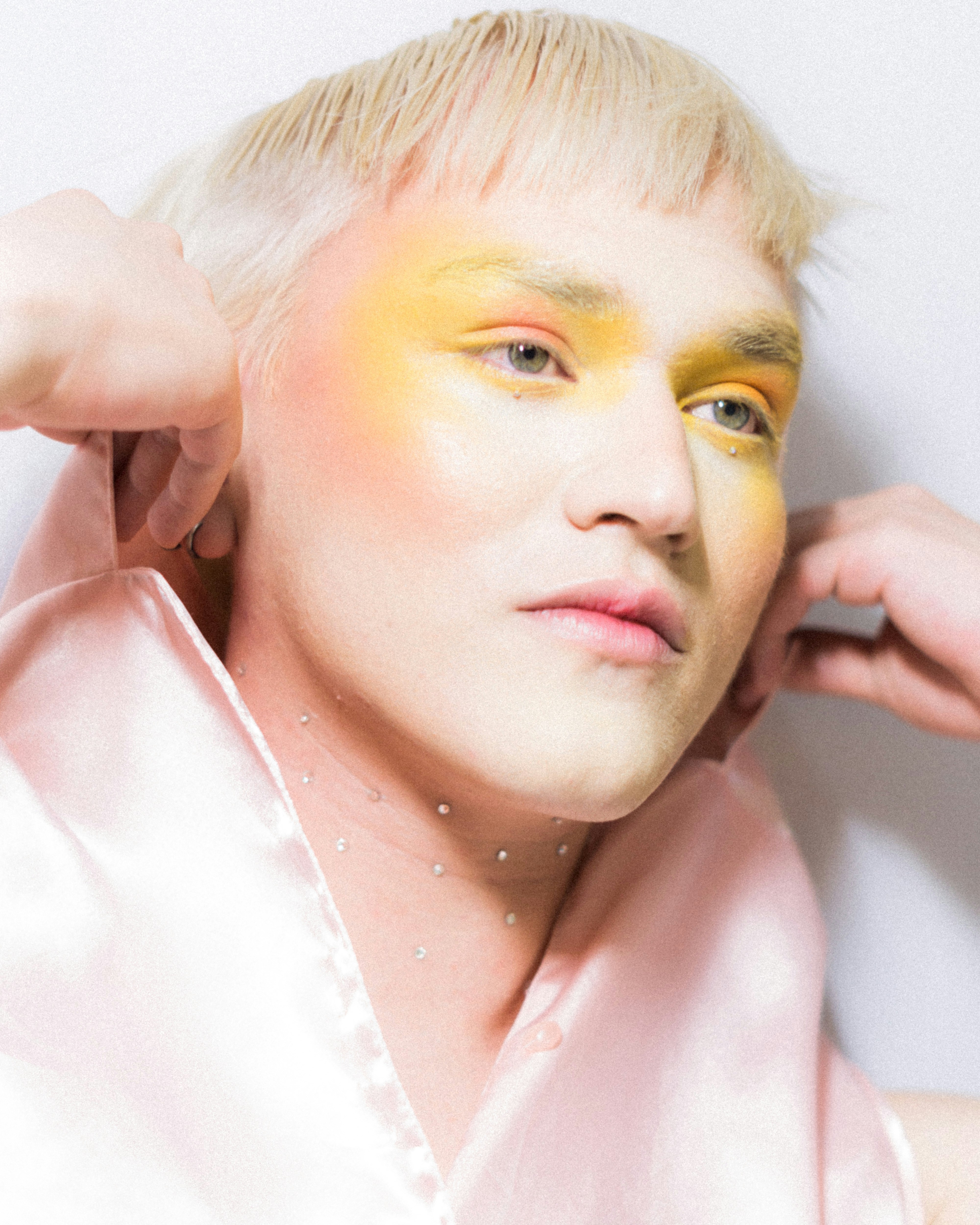 A woman with a yellow face paint on her face photo – Free Head Image on ...