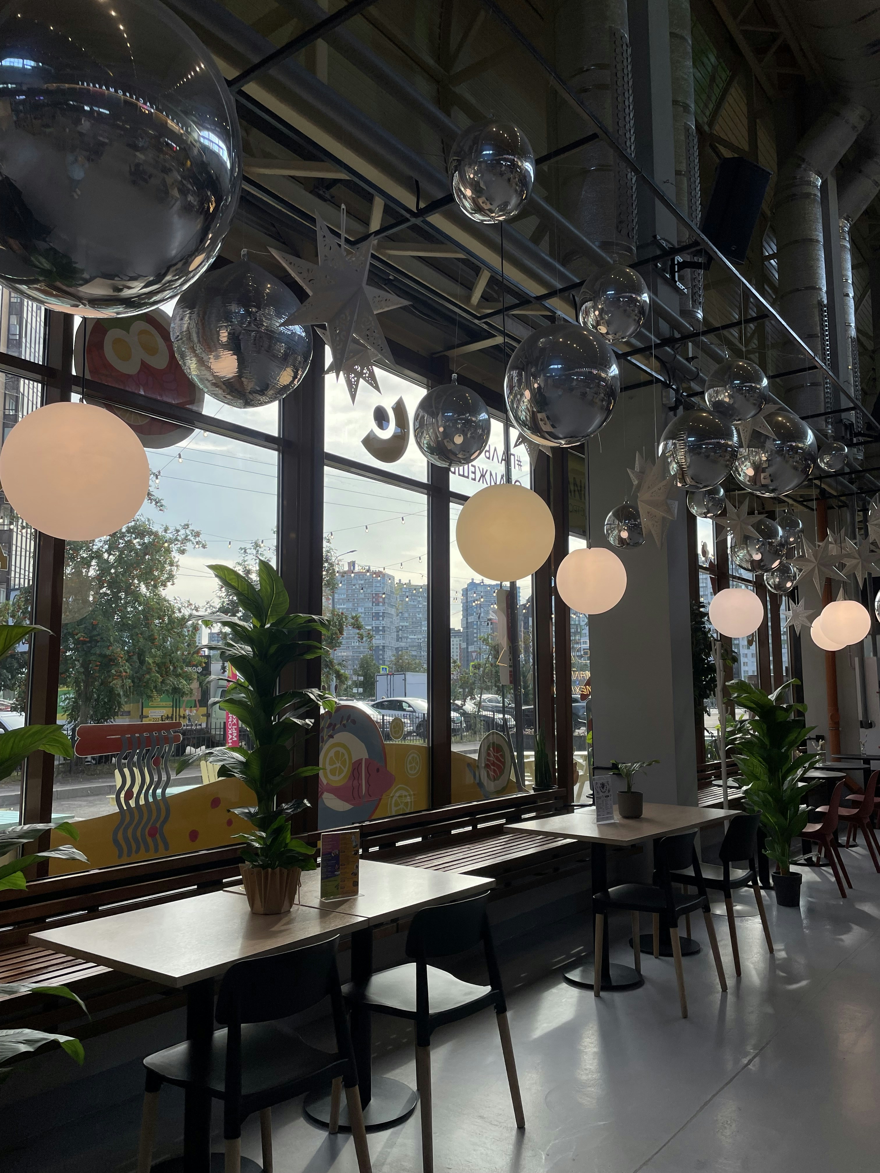 A restaurant with large windows and hanging lights photo – Free Cafe ...