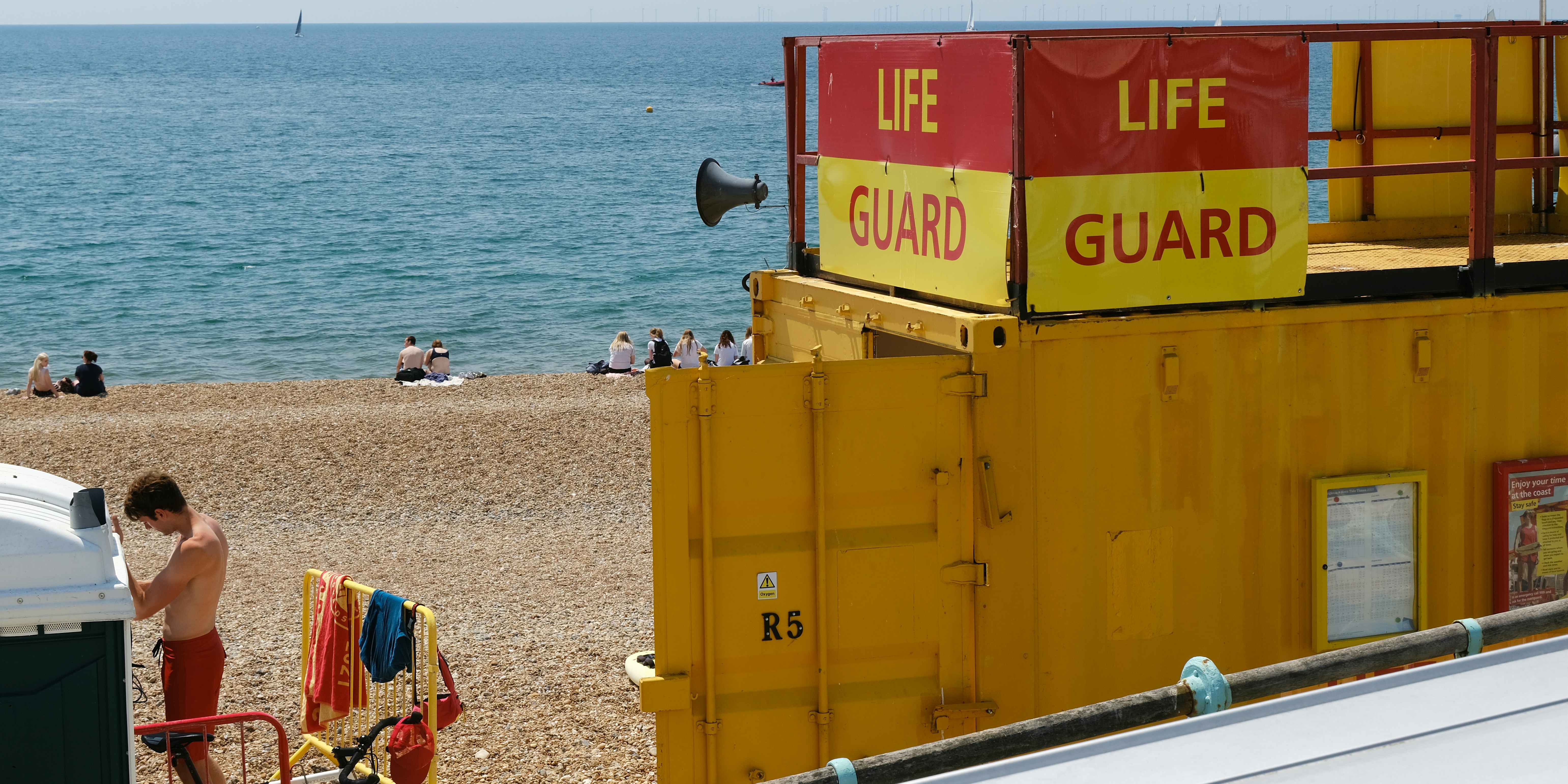 Yellow Lifeguard Outpost Overlooking a Quiet Beach