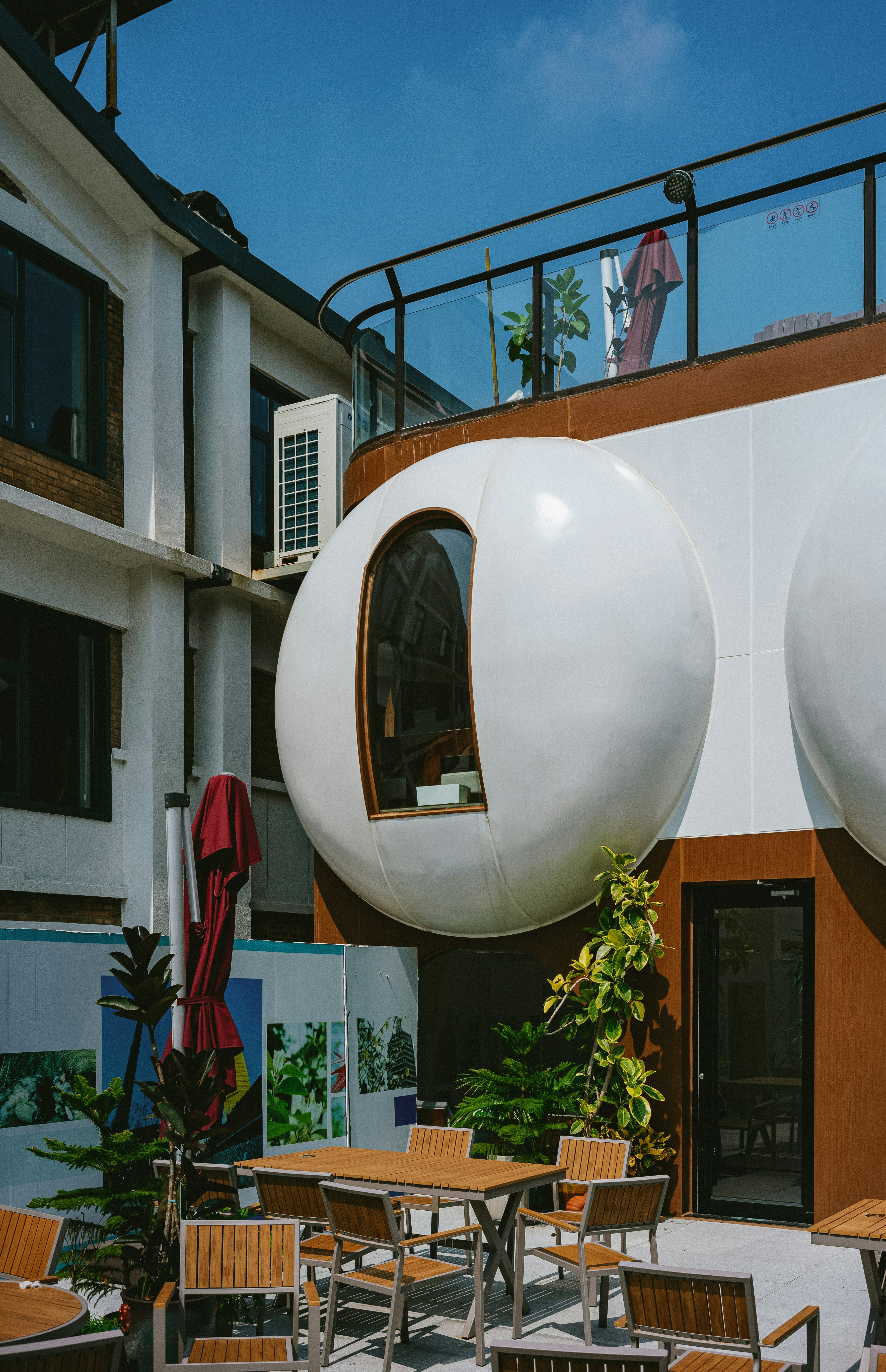 A group of tables and chairs outside of a building photo – Free ...