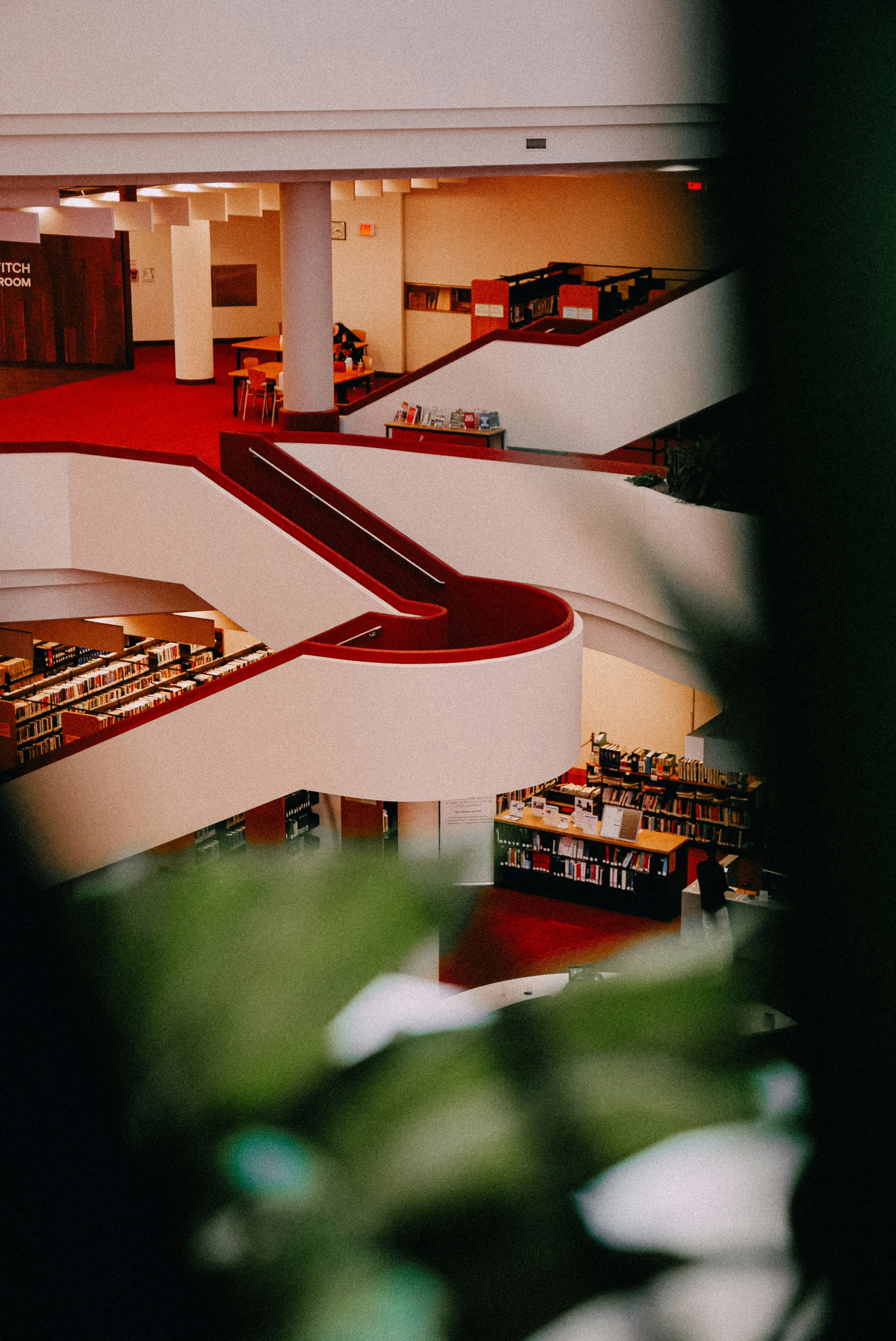 A view of a library from the top of a staircase photo – Free Library ...