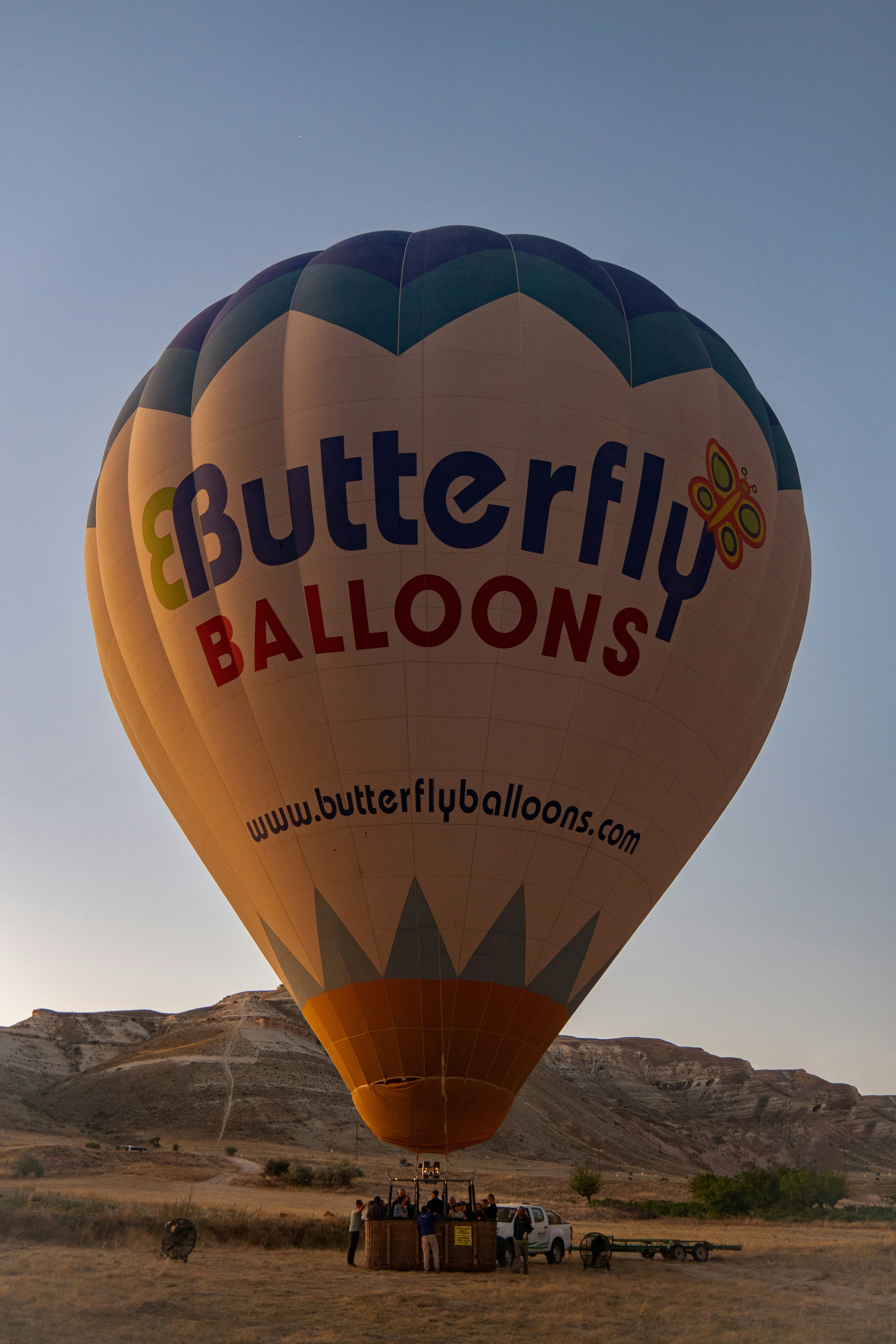 A large hot air balloon with the word butterfluf balloons written on it ...