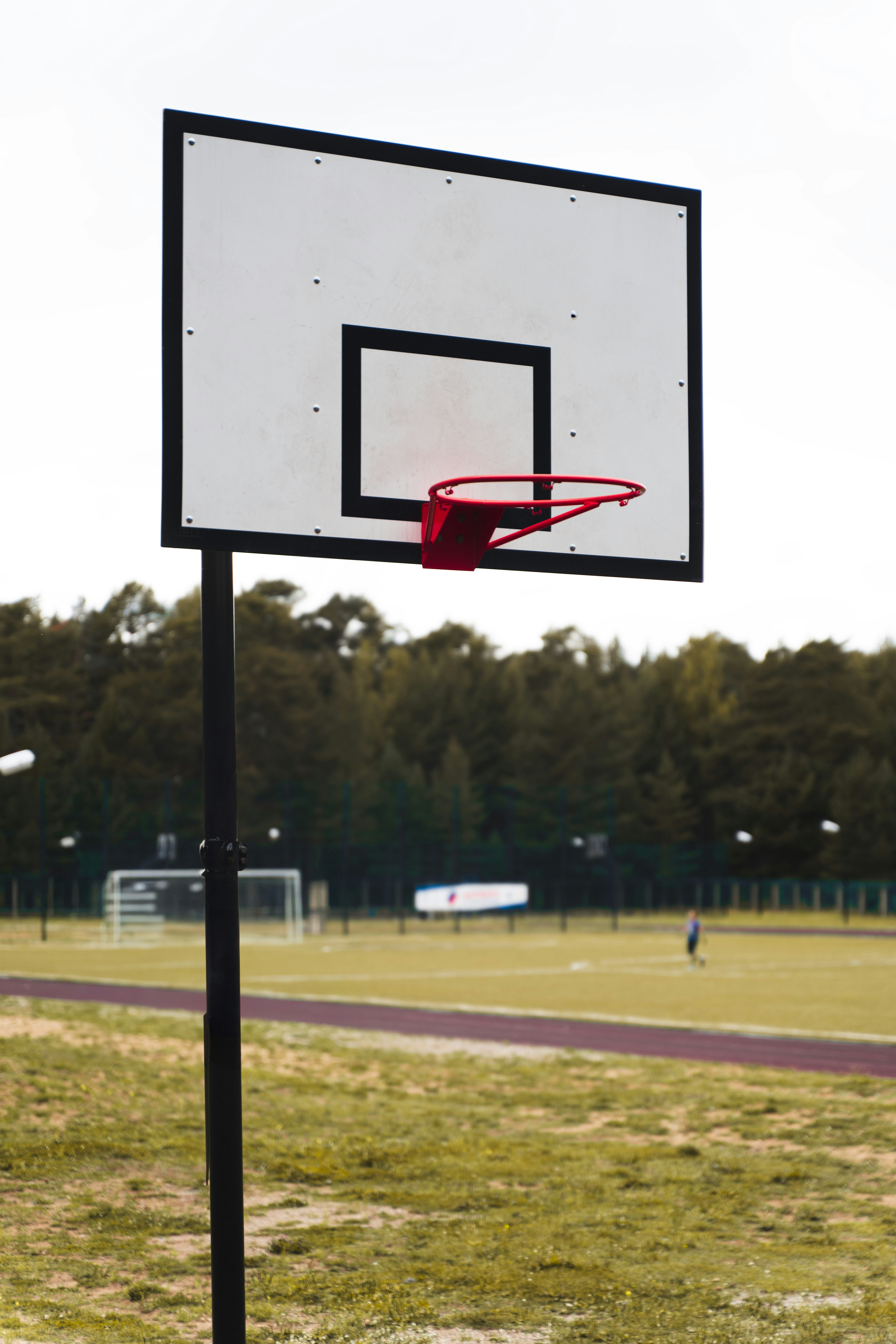 A basketball hoop with a basketball in it photo – Free Basketball court ...