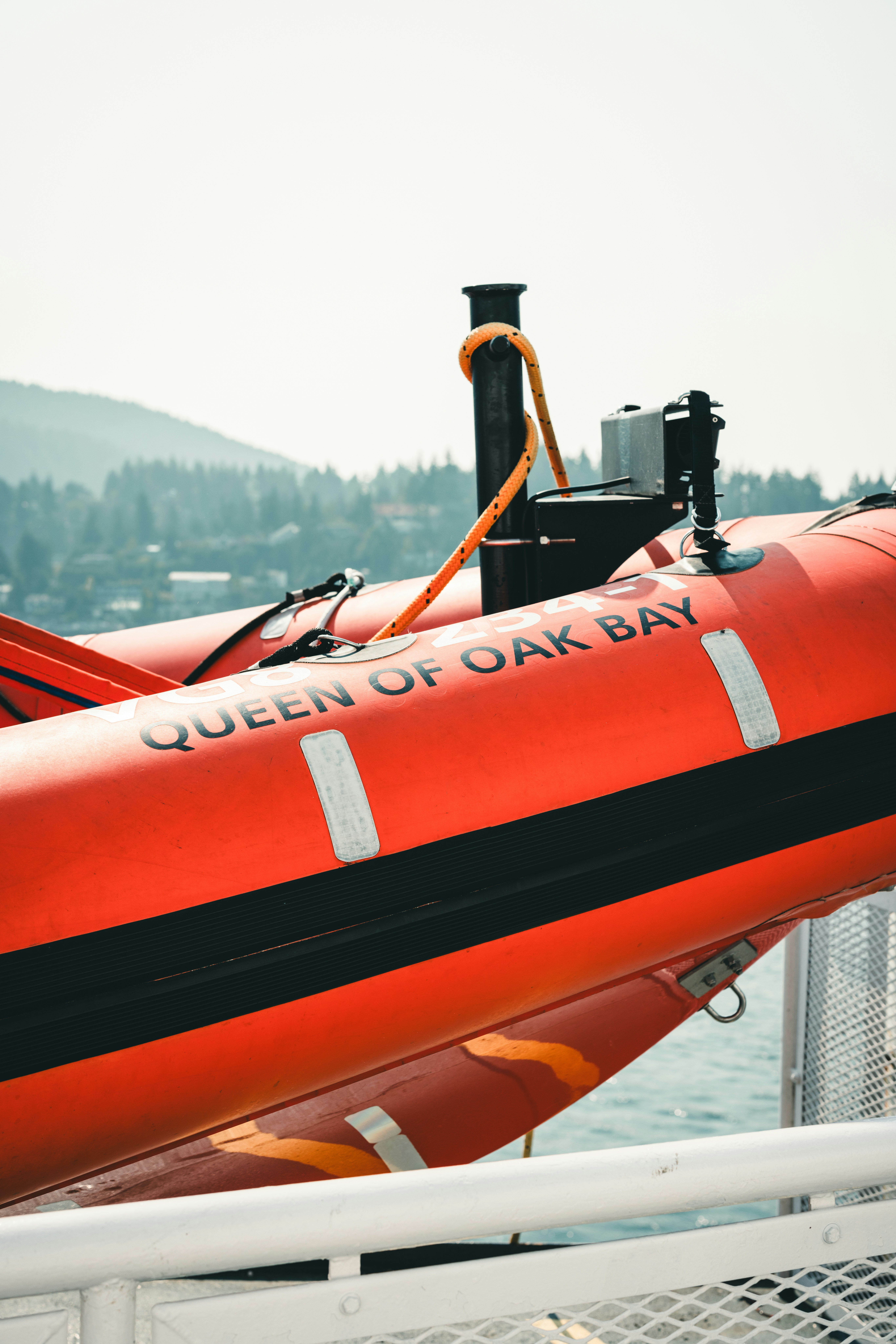 A red and black boat in the water photo – Free Vancouver Image on Unsplash