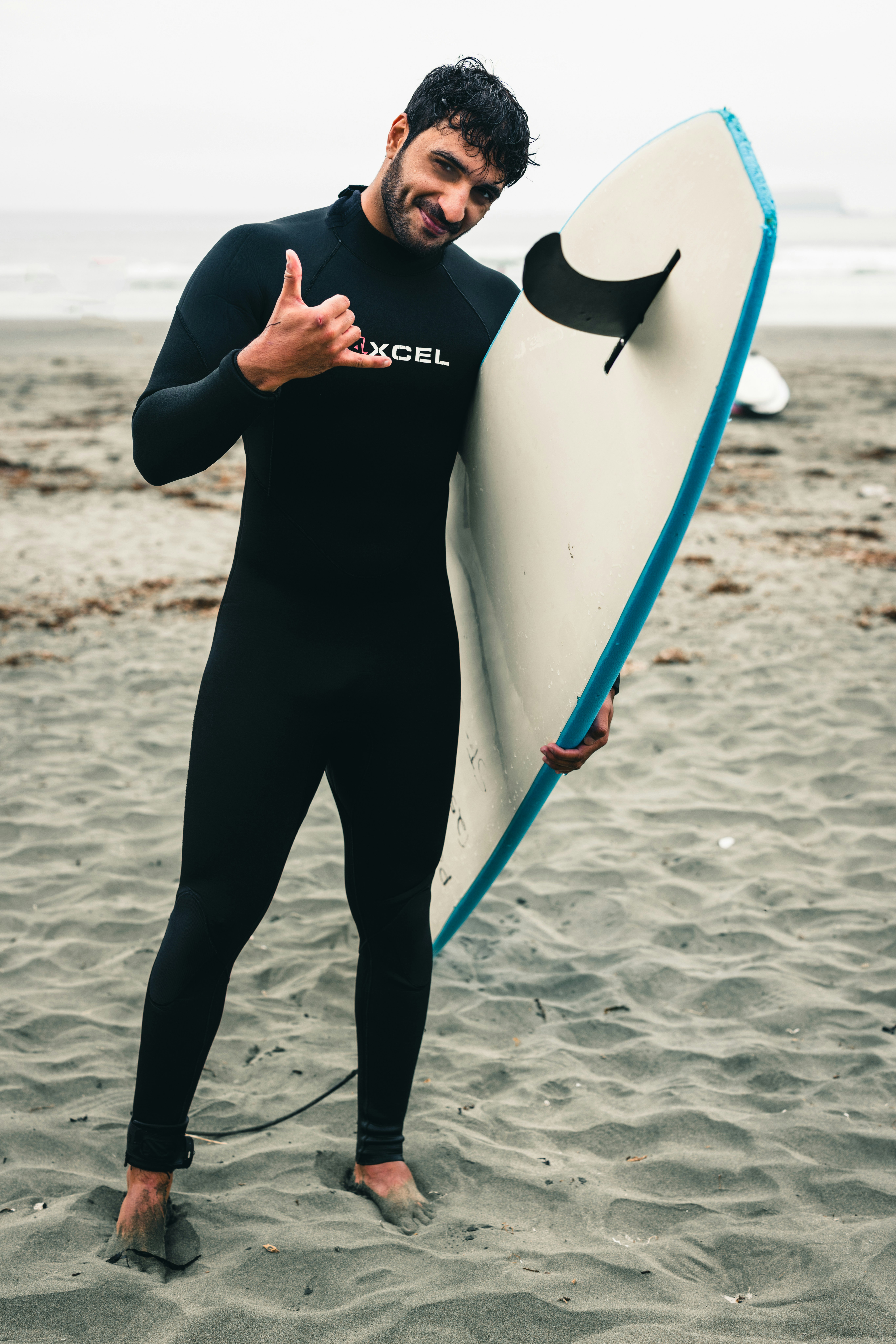 Shaka by the Shore: Quiet Confidence with a Surfboard