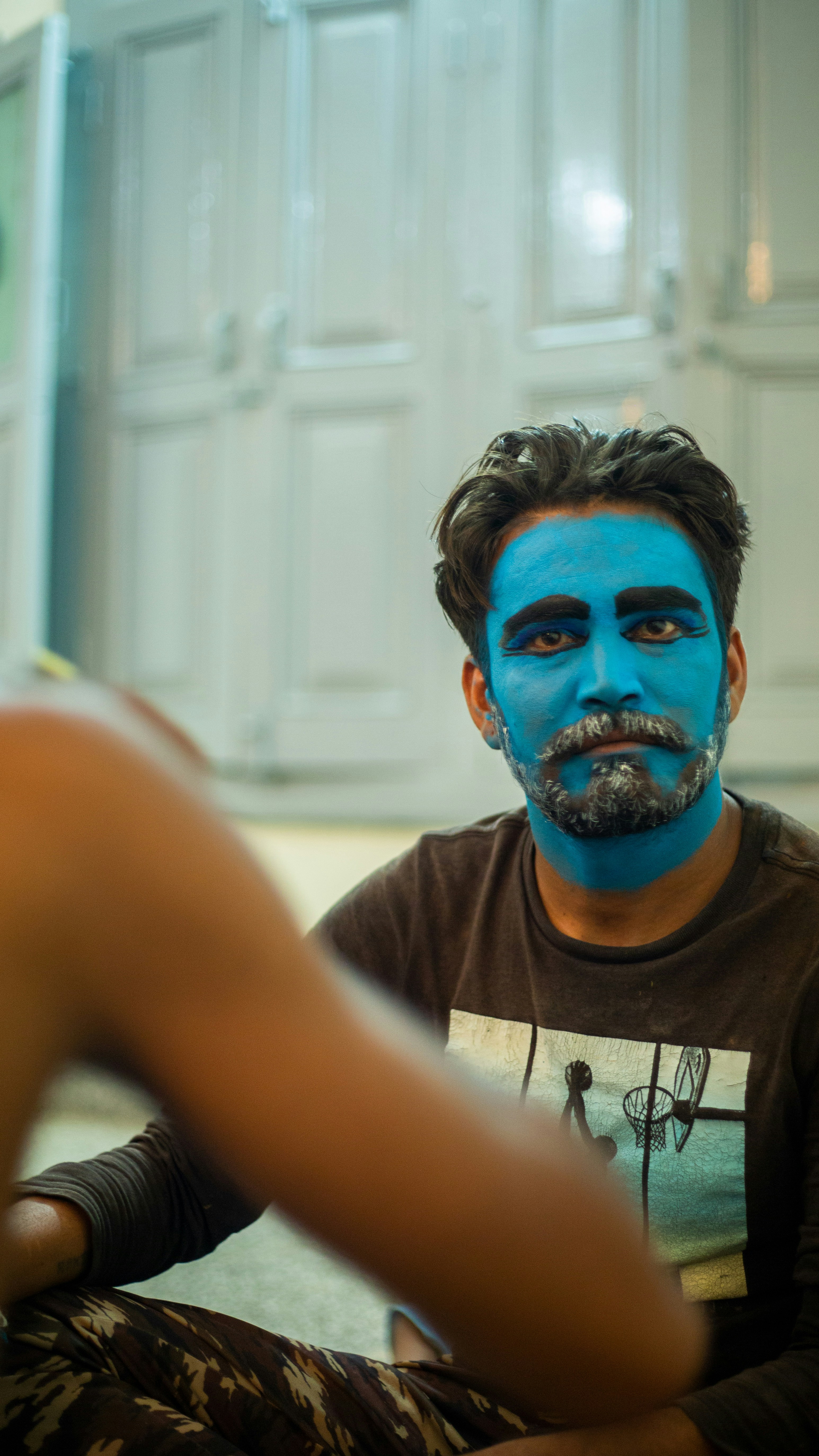 A man with blue face paint on his face photo – Free Indianfestivities ...
