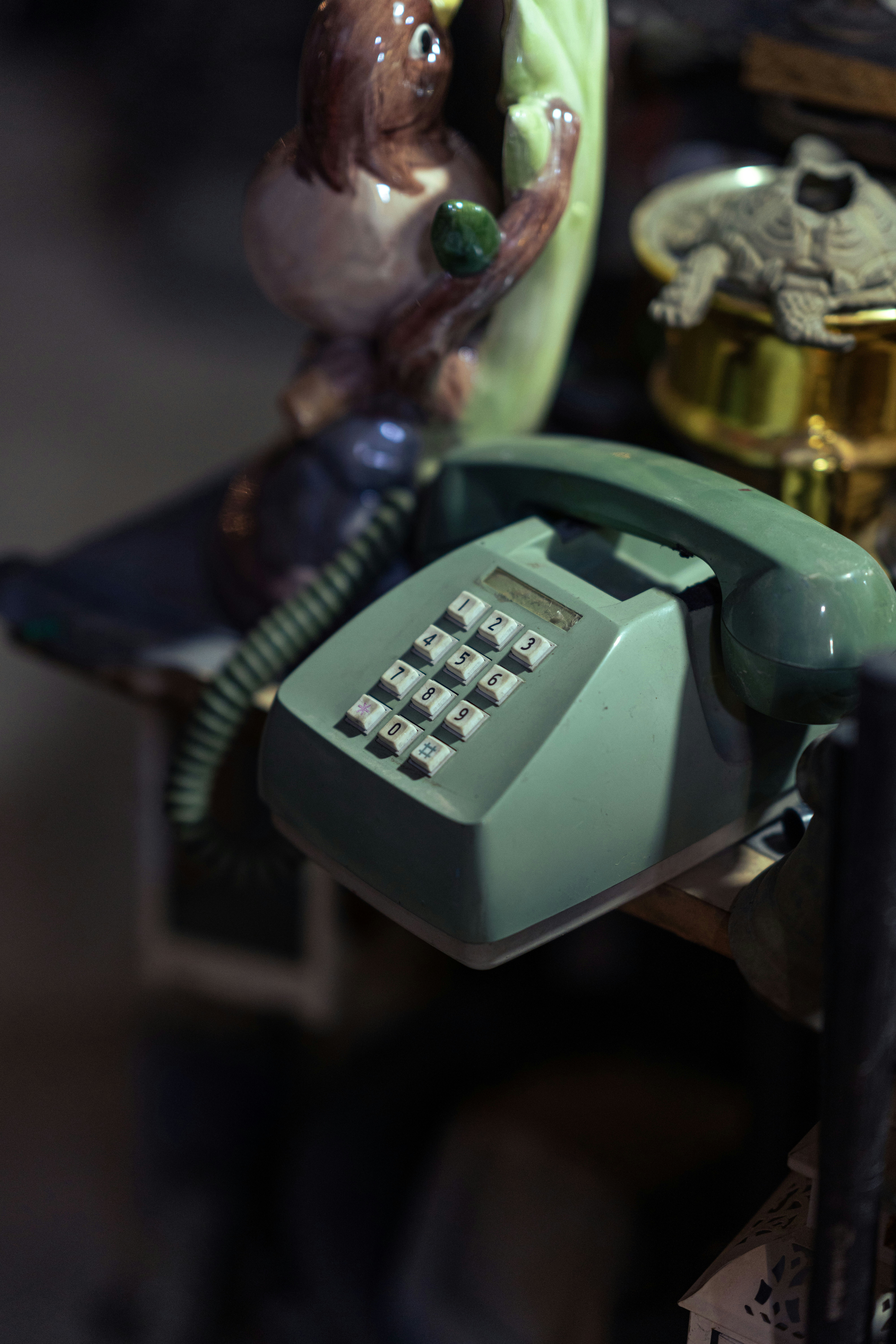 Teal Vintage Telephone Anchors a Quiet Desk Still Life