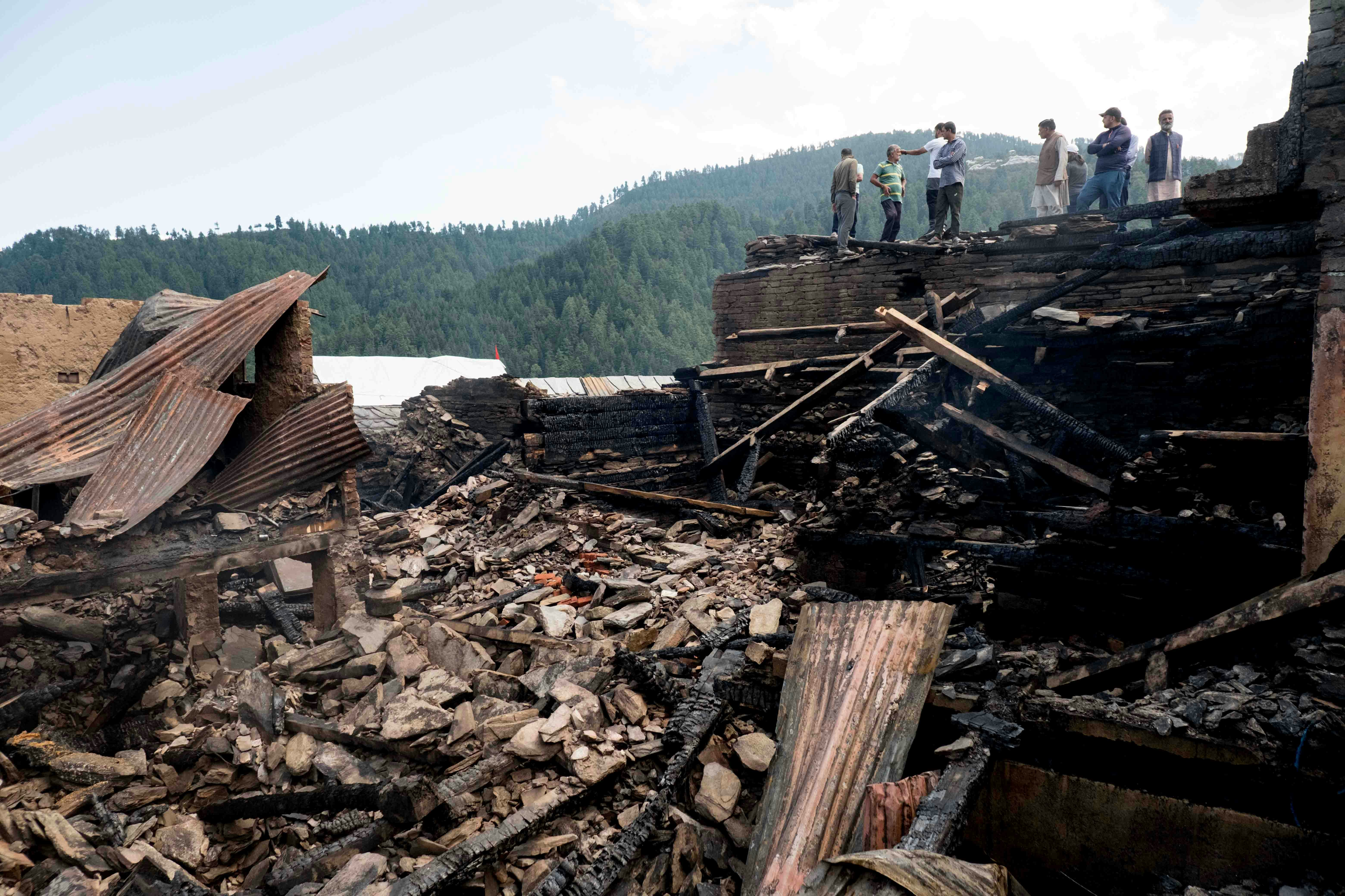 Rubble's Edge: Onlookers Over a Crumbled Structure